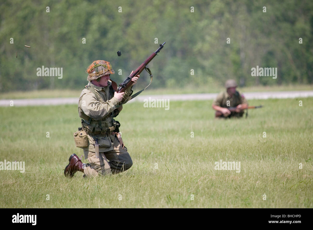 World War II reenactment of a battle between American infantryman and ...