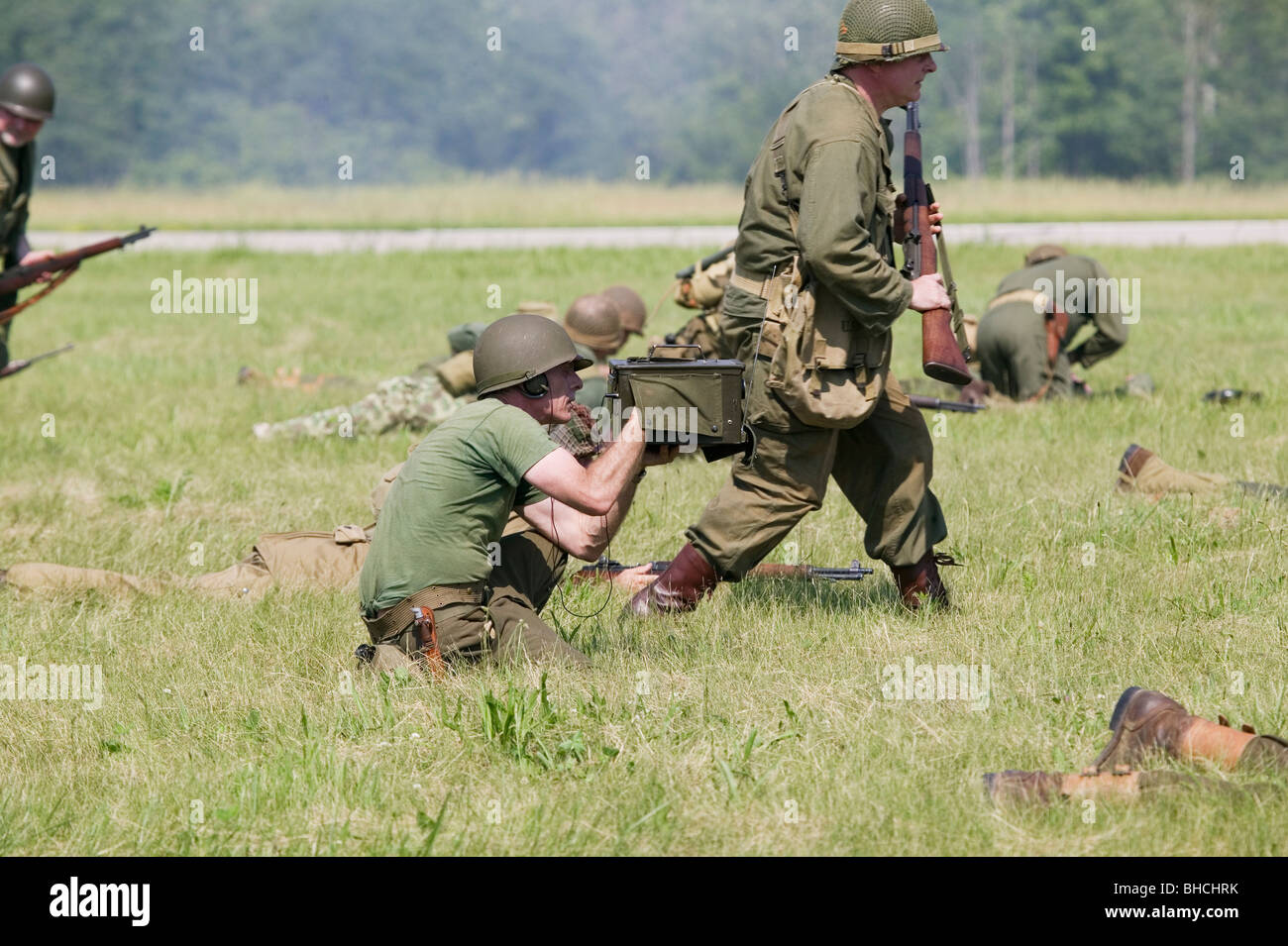 World War II reenactment of a battle between American infantryman and ...