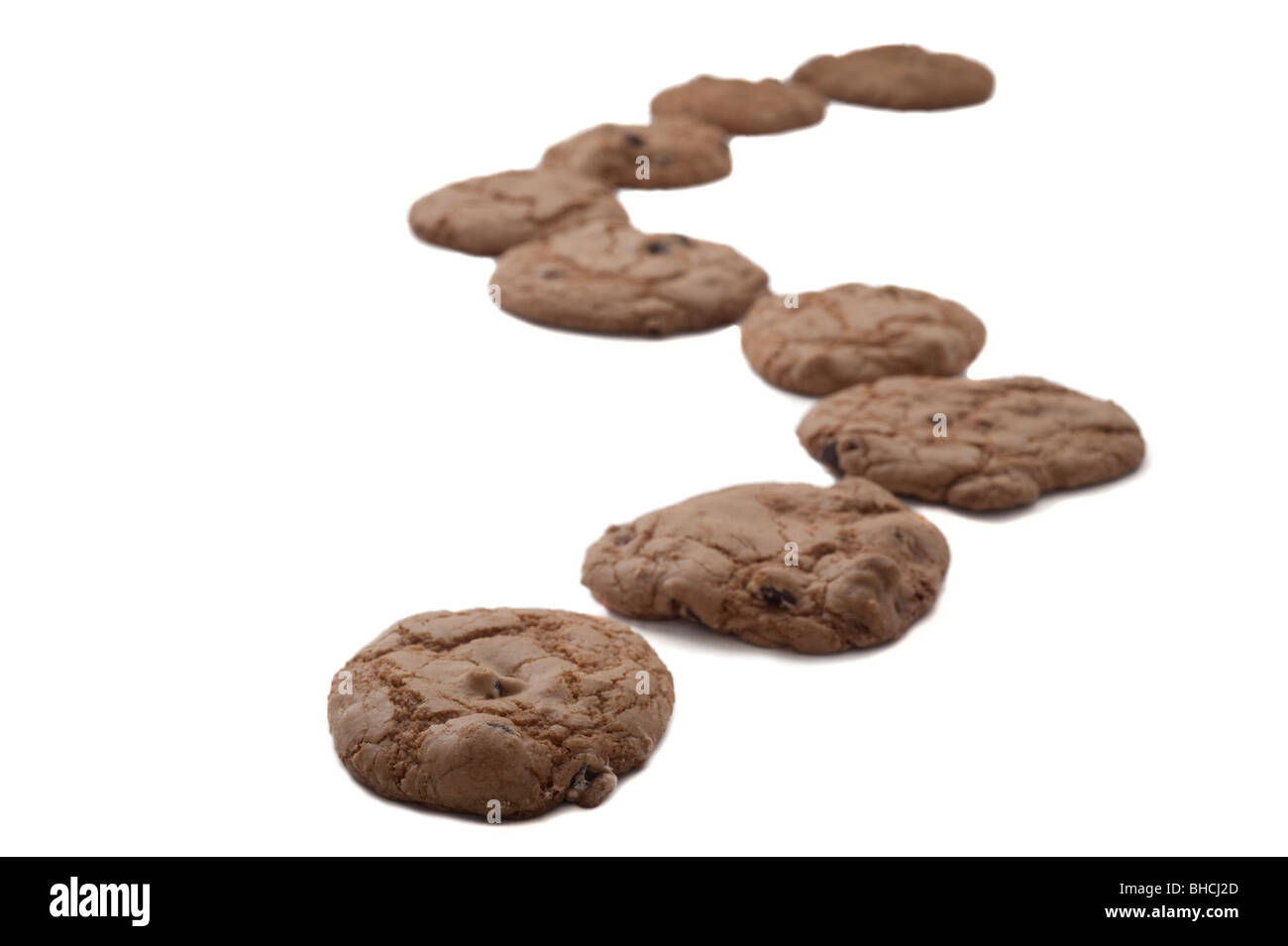 Chocolate chip cookies arranged as in a winding path Stock Photo - Alamy