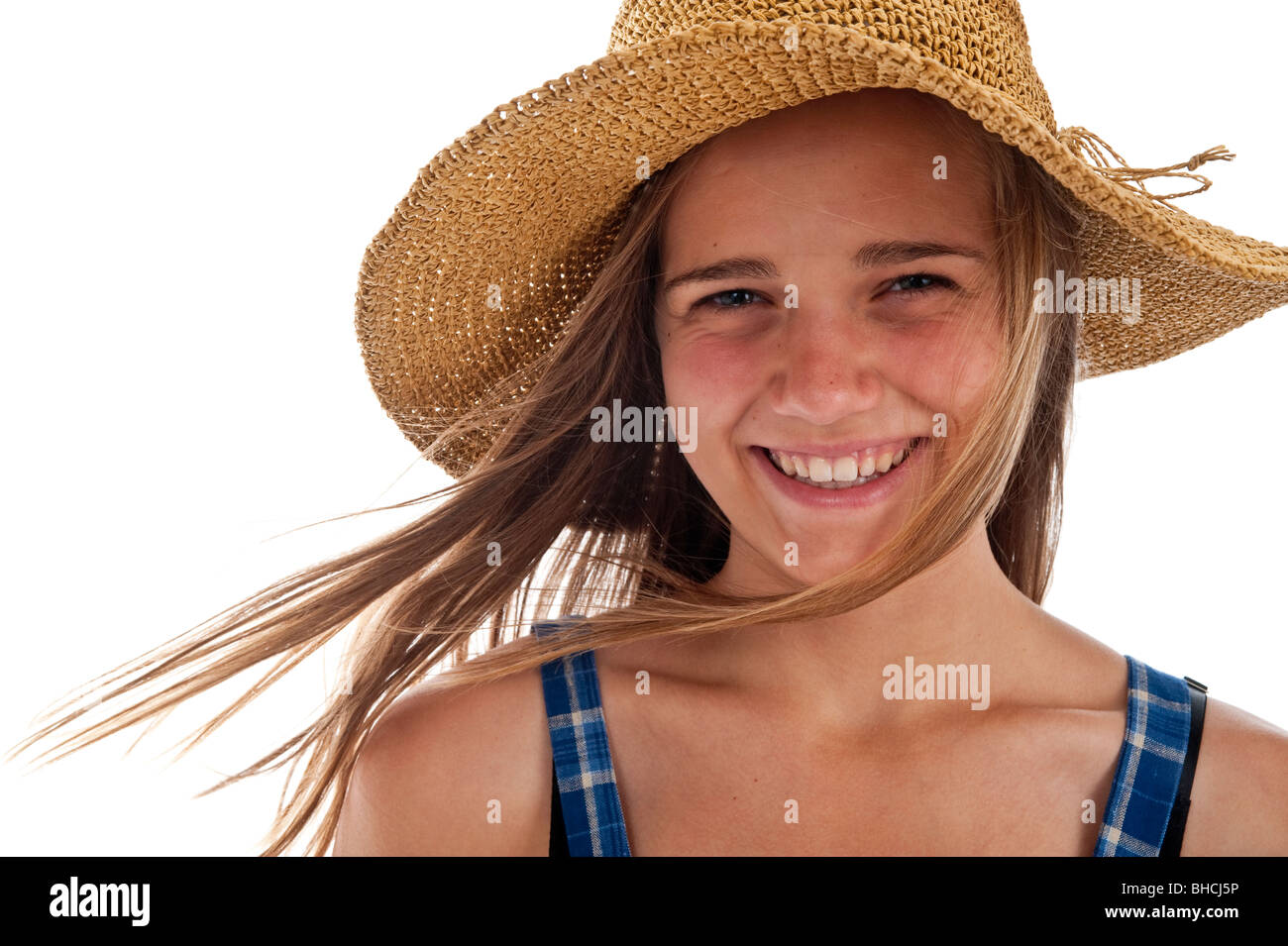Pretty teen girl wearing an old straw had Stock Photo - Alamy