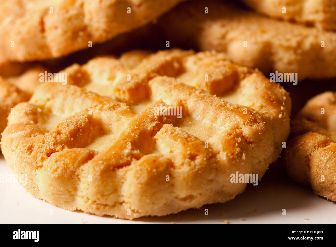 Close up of a pile of biscuits isolated on white Stock Photo - Alamy