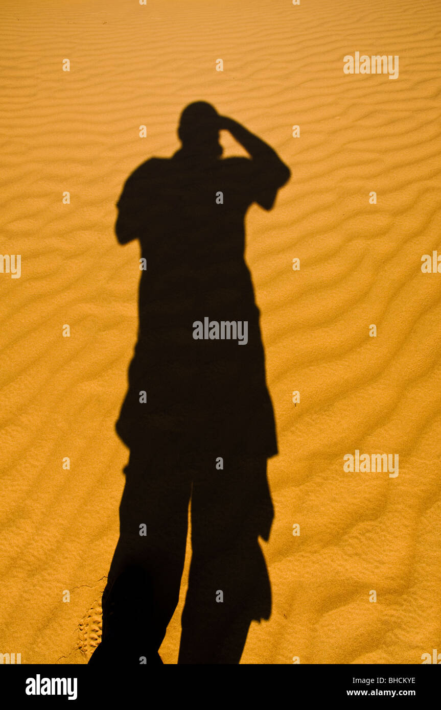 Silhouette of man with camera in desert Stock Photo - Alamy