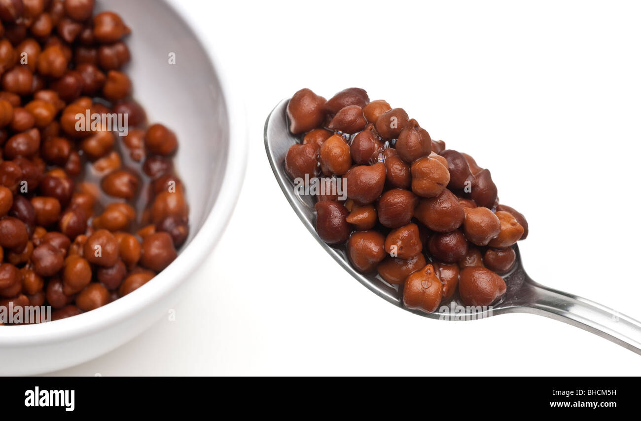Spoonful of Kala Chana beans in water lifted on a spoon Stock Photo - Alamy