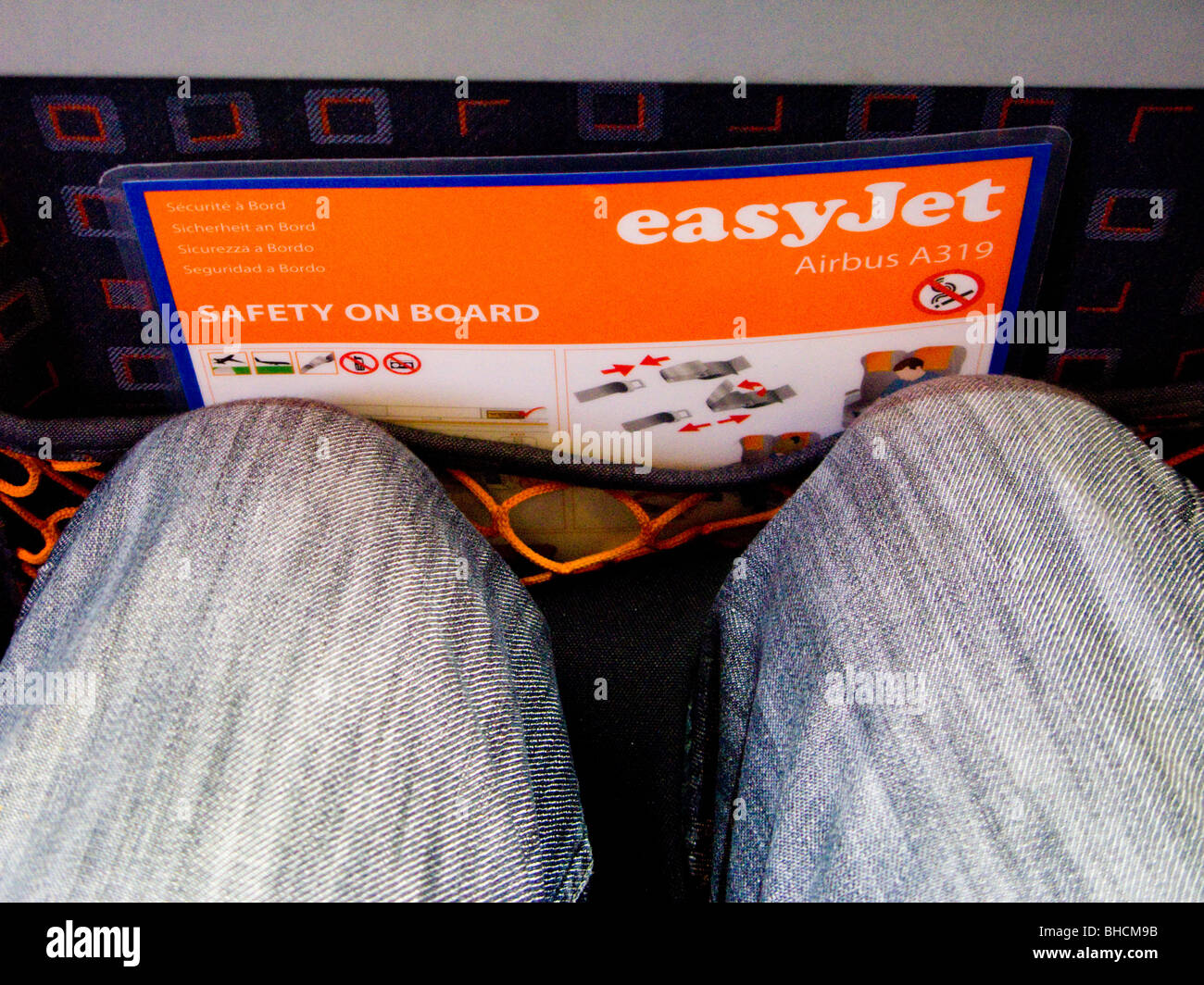 Man plane leg room hi-res stock photography and images - Alamy