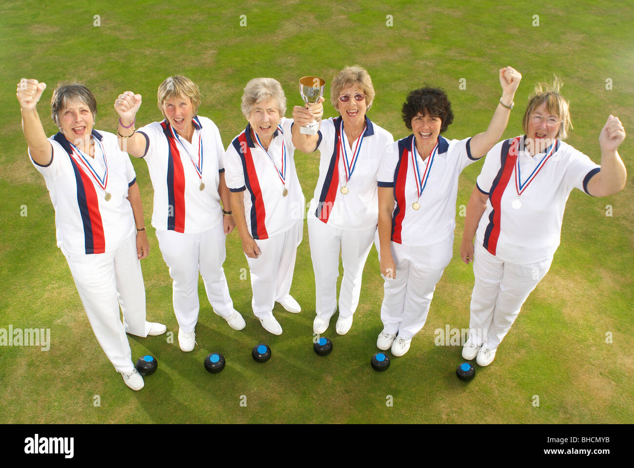 female bowls team and trophy Stock Photo - Alamy
