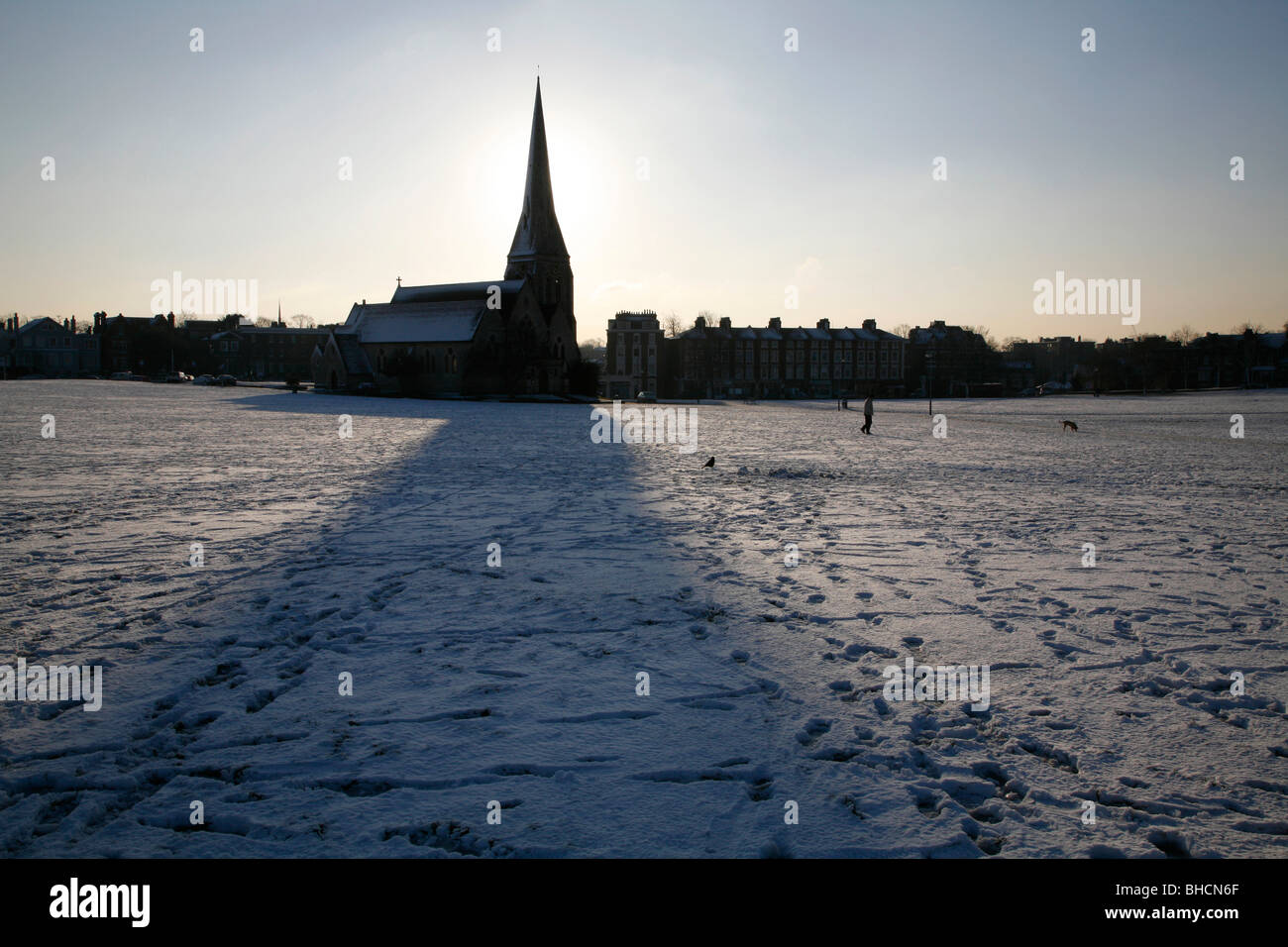 All Saints church casts it shadow over a snowy Blackheath Common ...