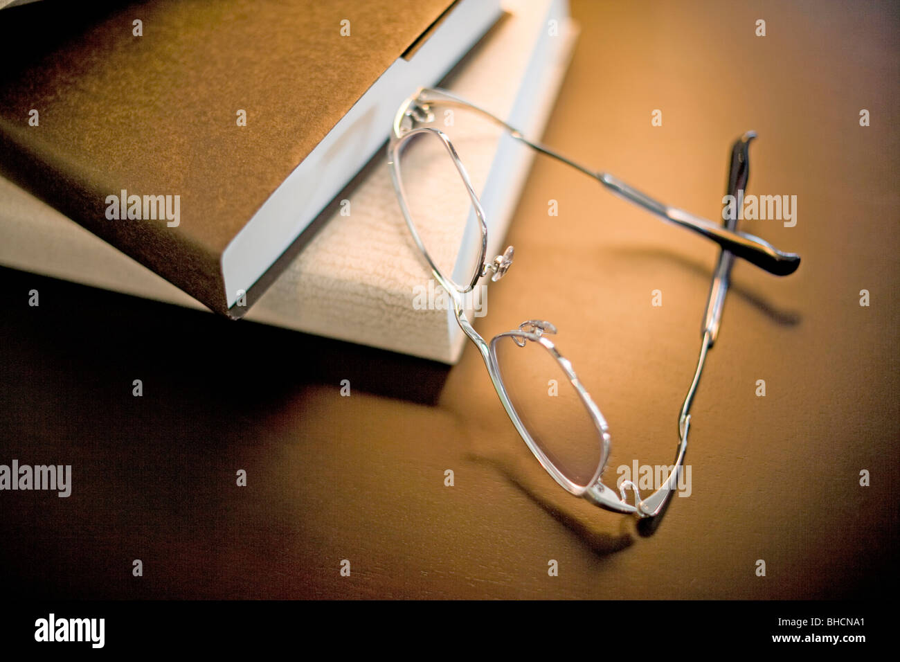 Books and glasses Stock Photo - Alamy