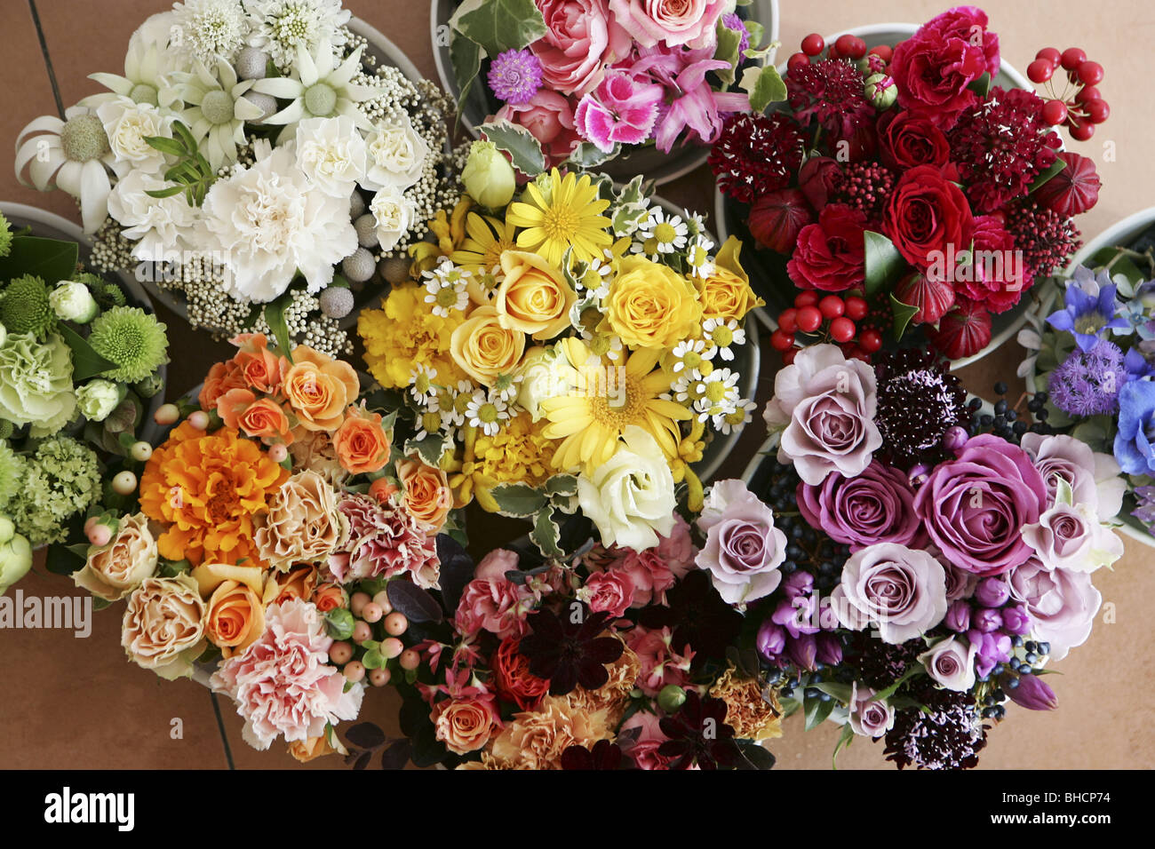 Bunches of flowers in buckets Stock Photo - Alamy