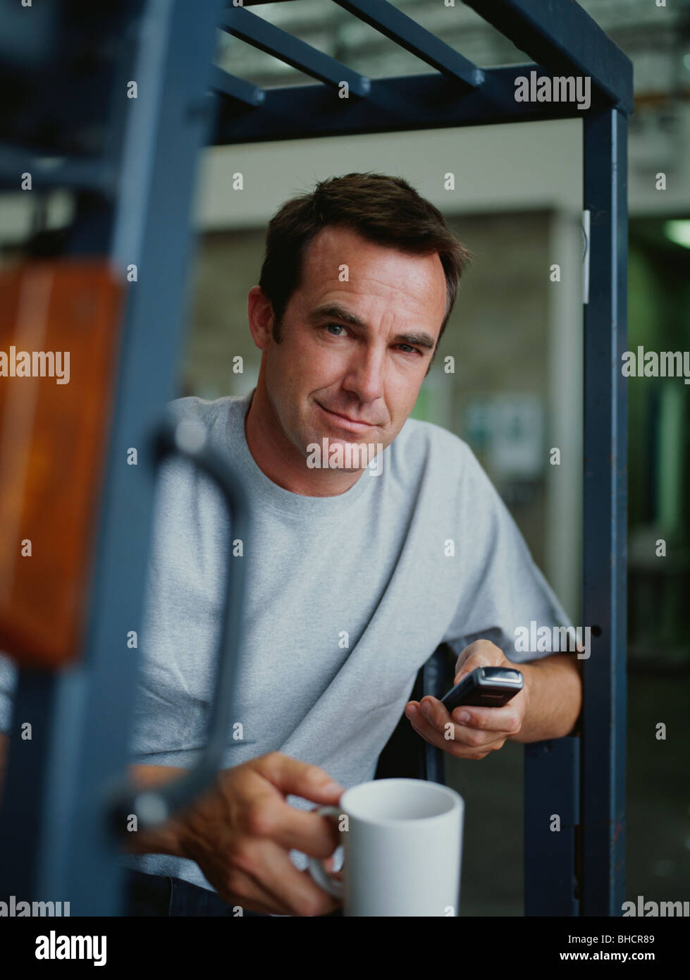 A warehouse manager takes a tea break Stock Photo - Alamy