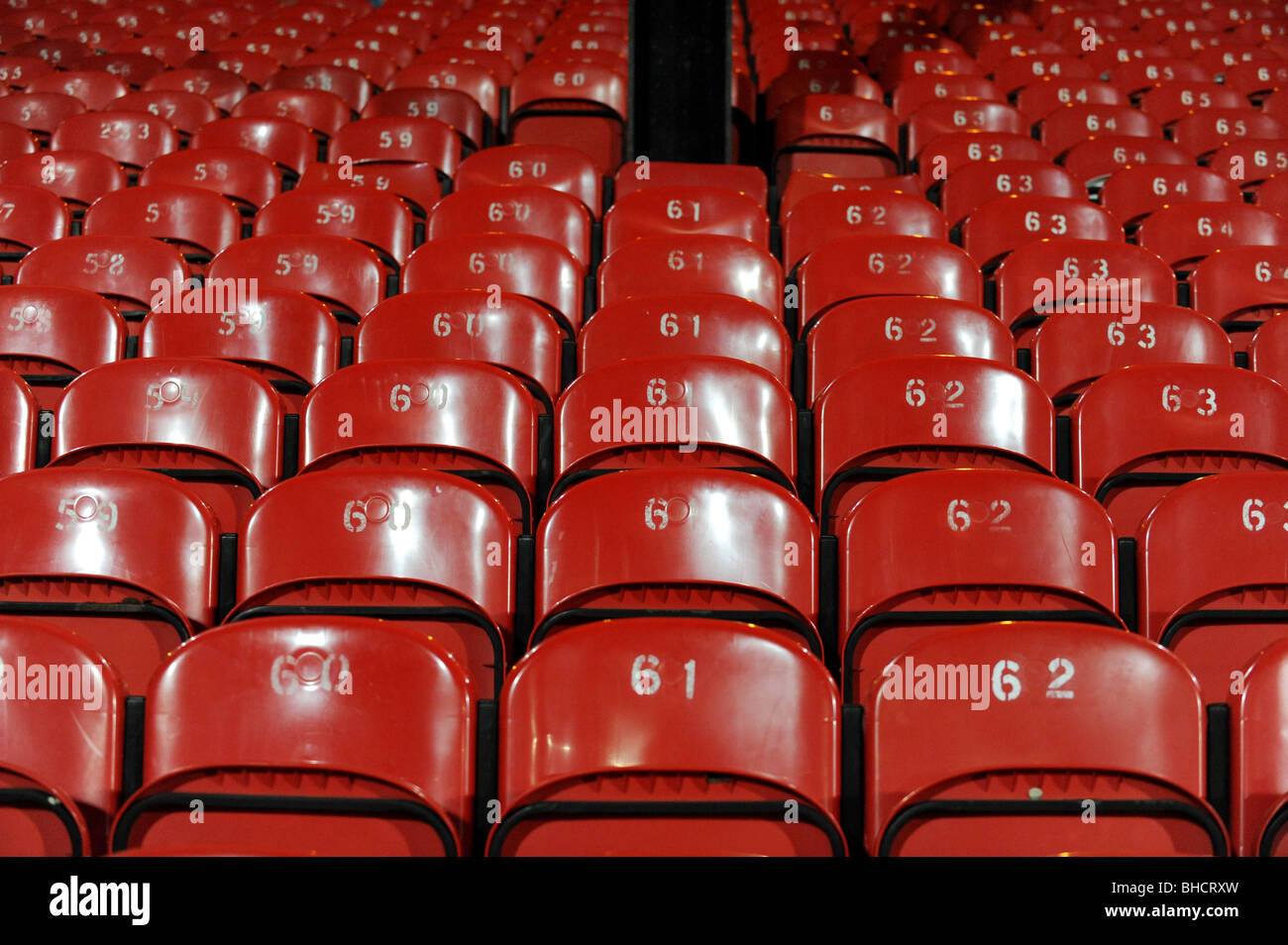 Red seating in the main stand at a sports stadium Stock Photo - Alamy