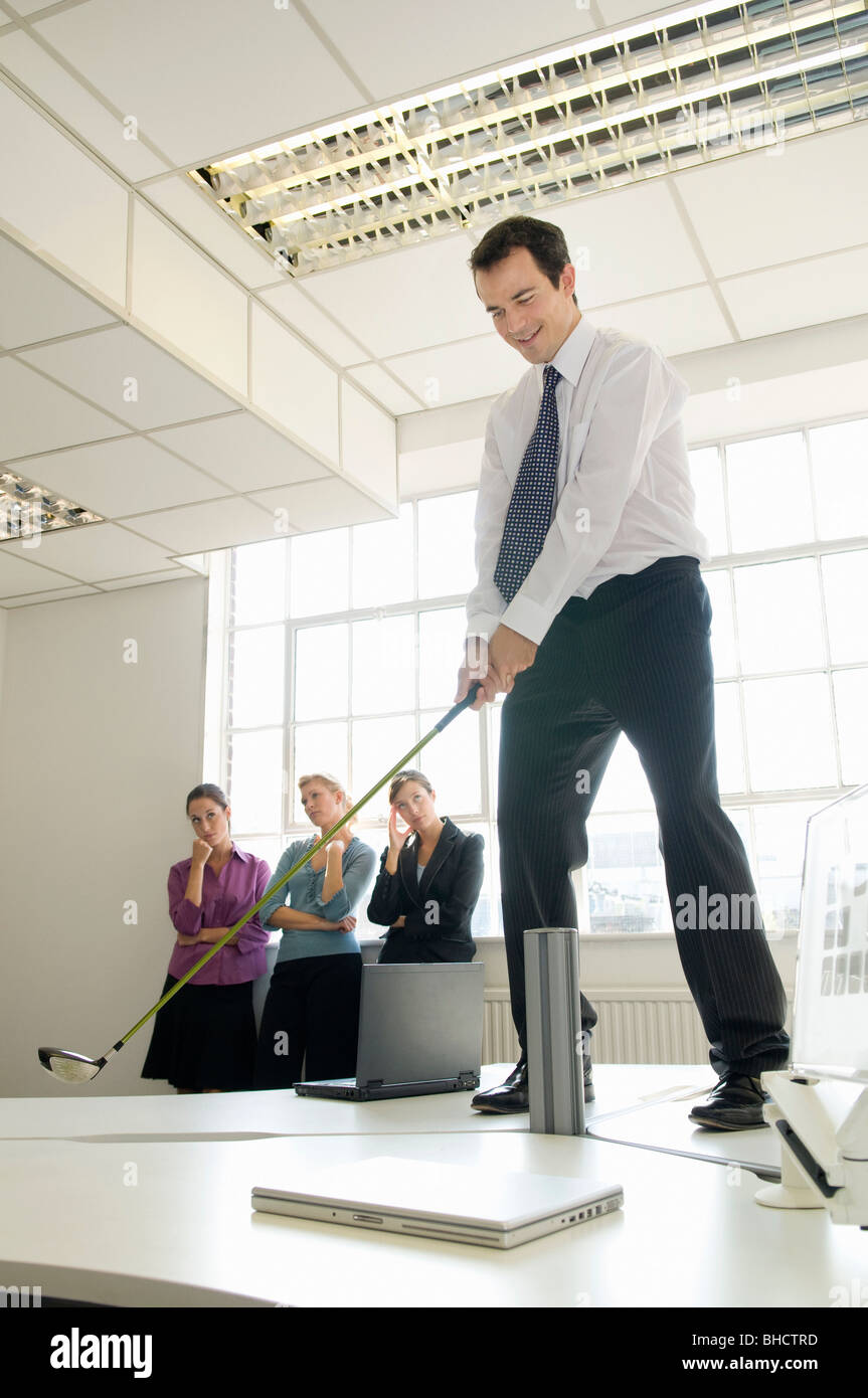 Business man playing golf Stock Photo - Alamy