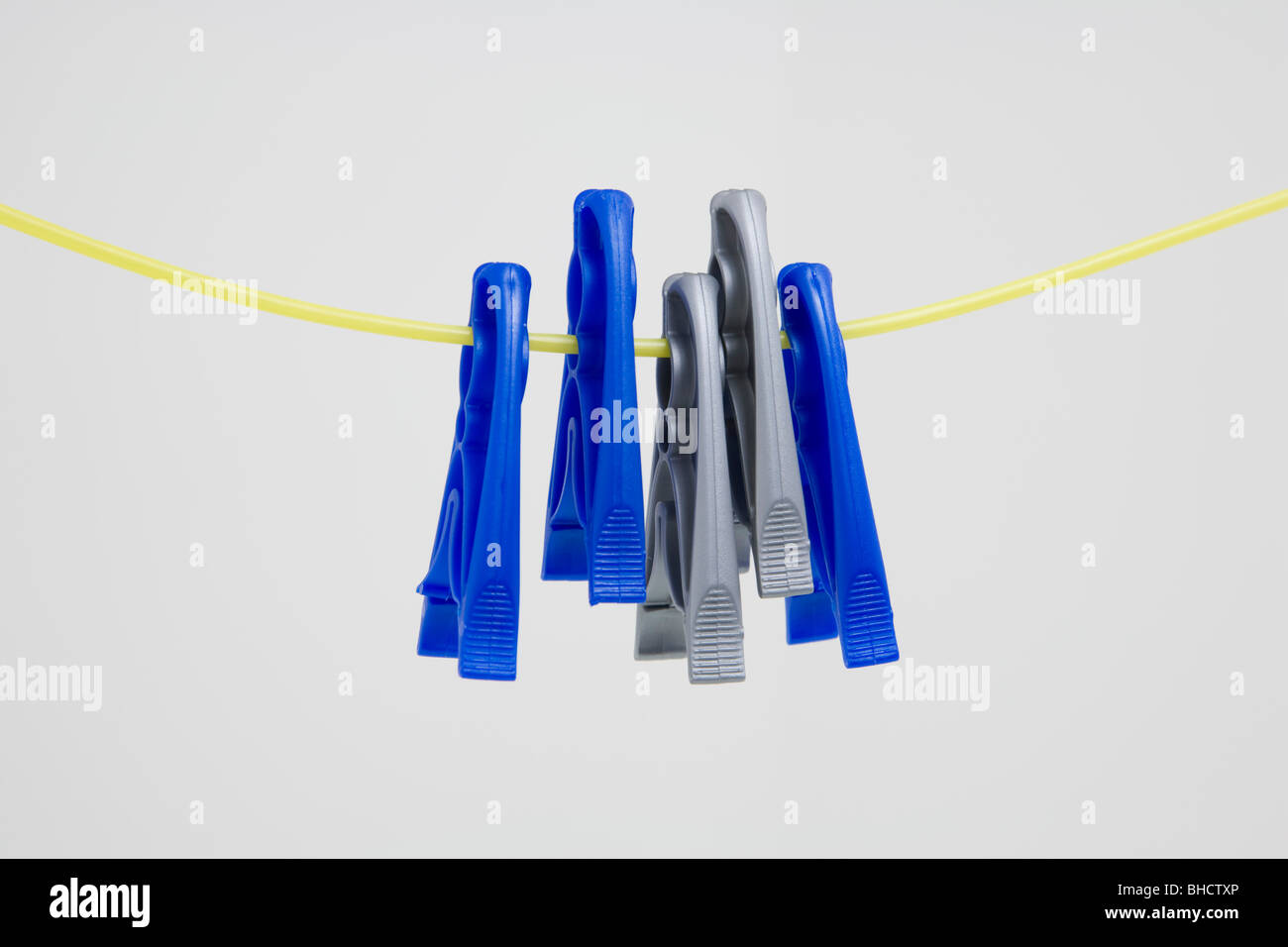 5 pegs on the clothing line Stock Photo - Alamy