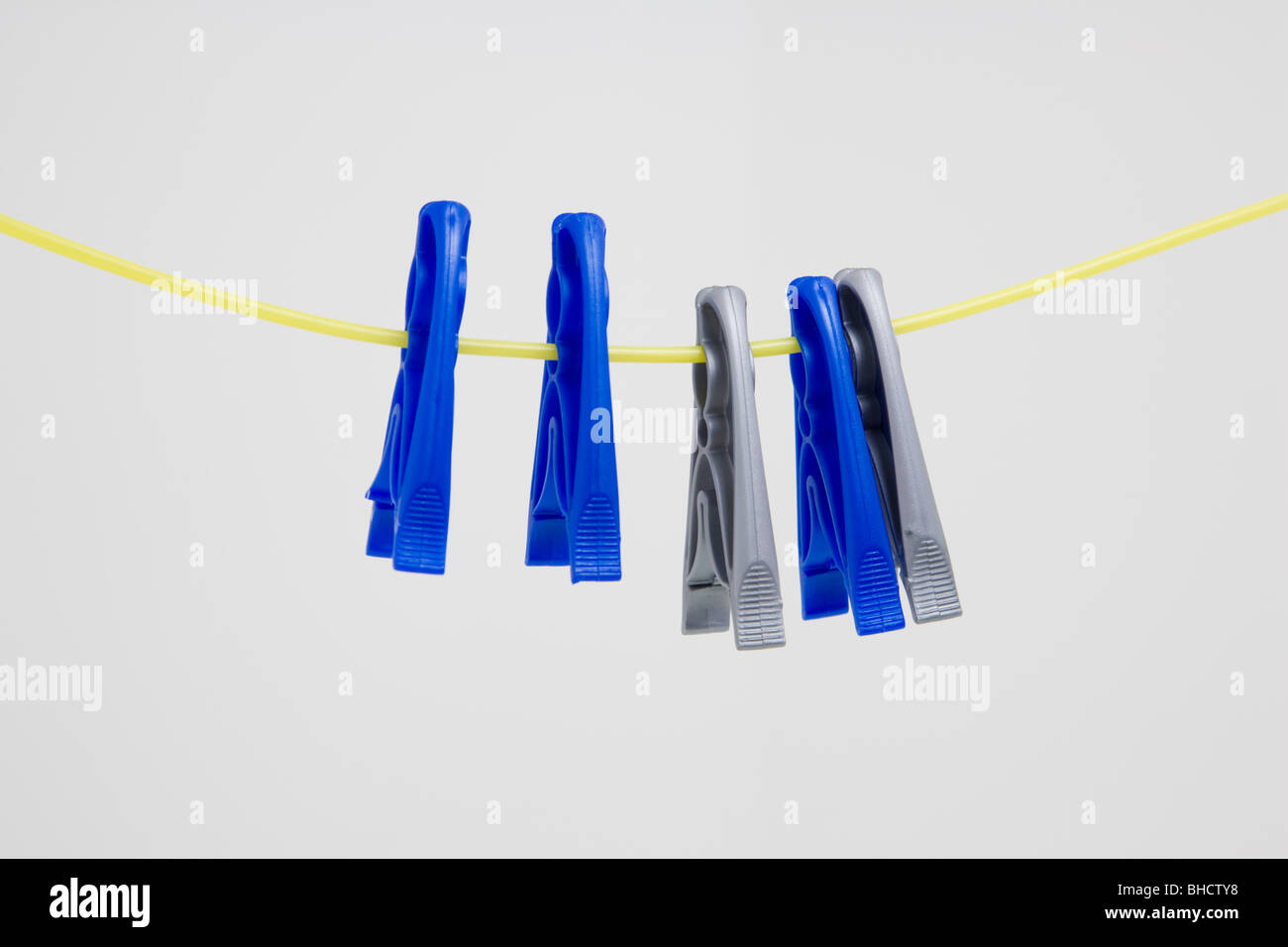 5 pegs on the clothing line Stock Photo - Alamy