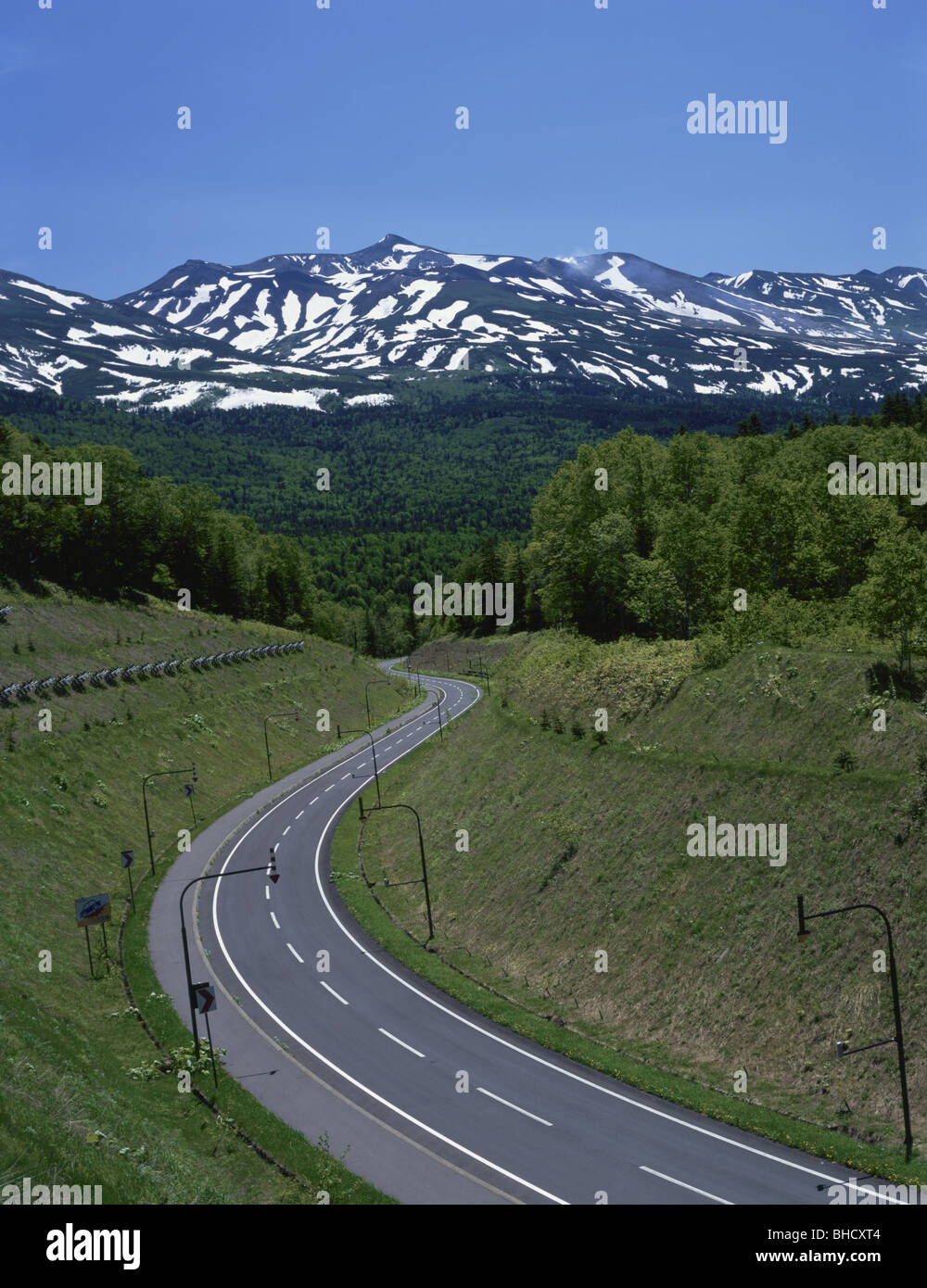 Mt Tokachi mountain range and winding road, Biei, Hokkaido, Japan Stock ...