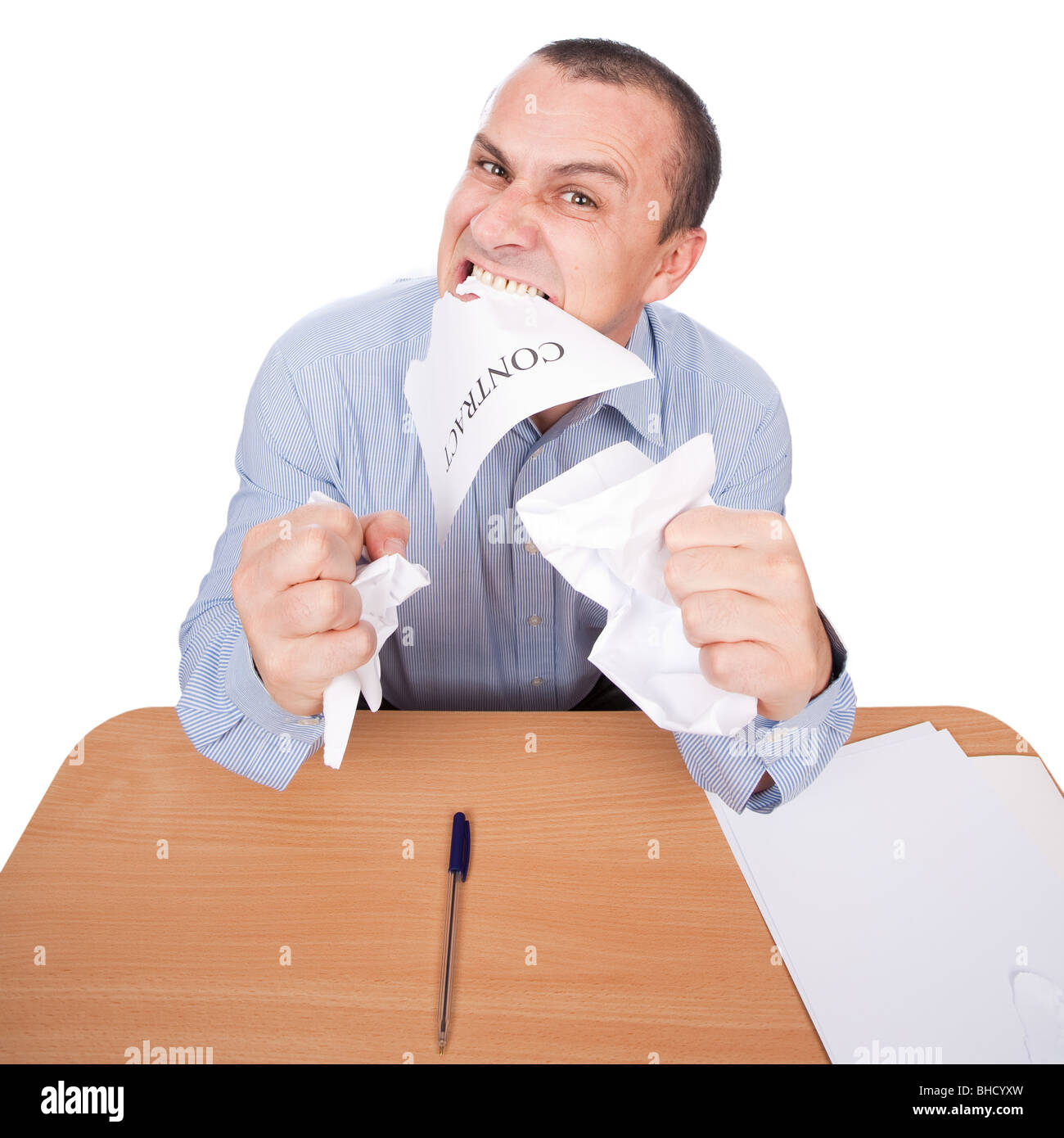 Mad businessman tearing apart a contract with his teeth, isolated on ...