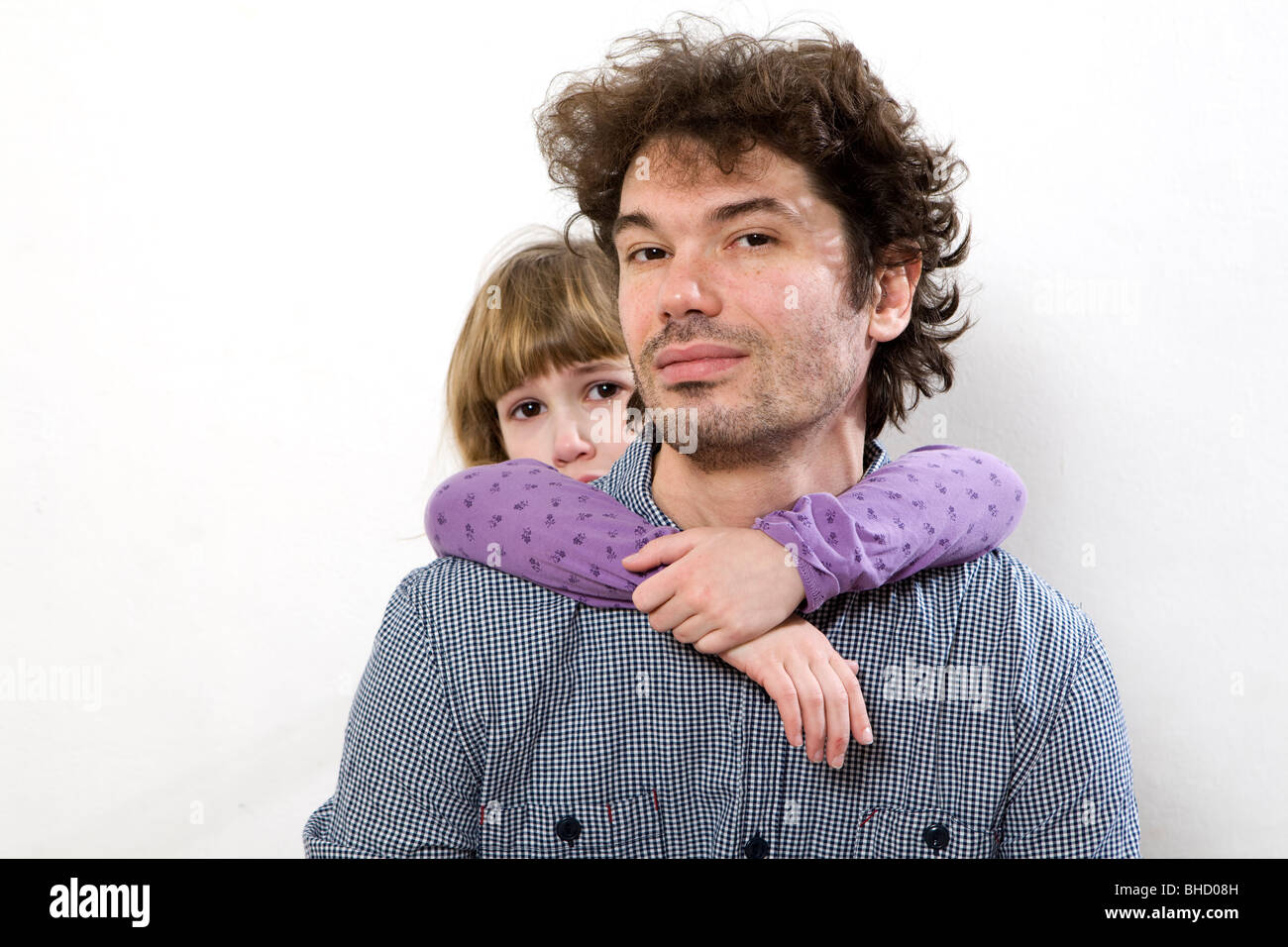 sad daughter hugs her calm father Stock Photo - Alamy