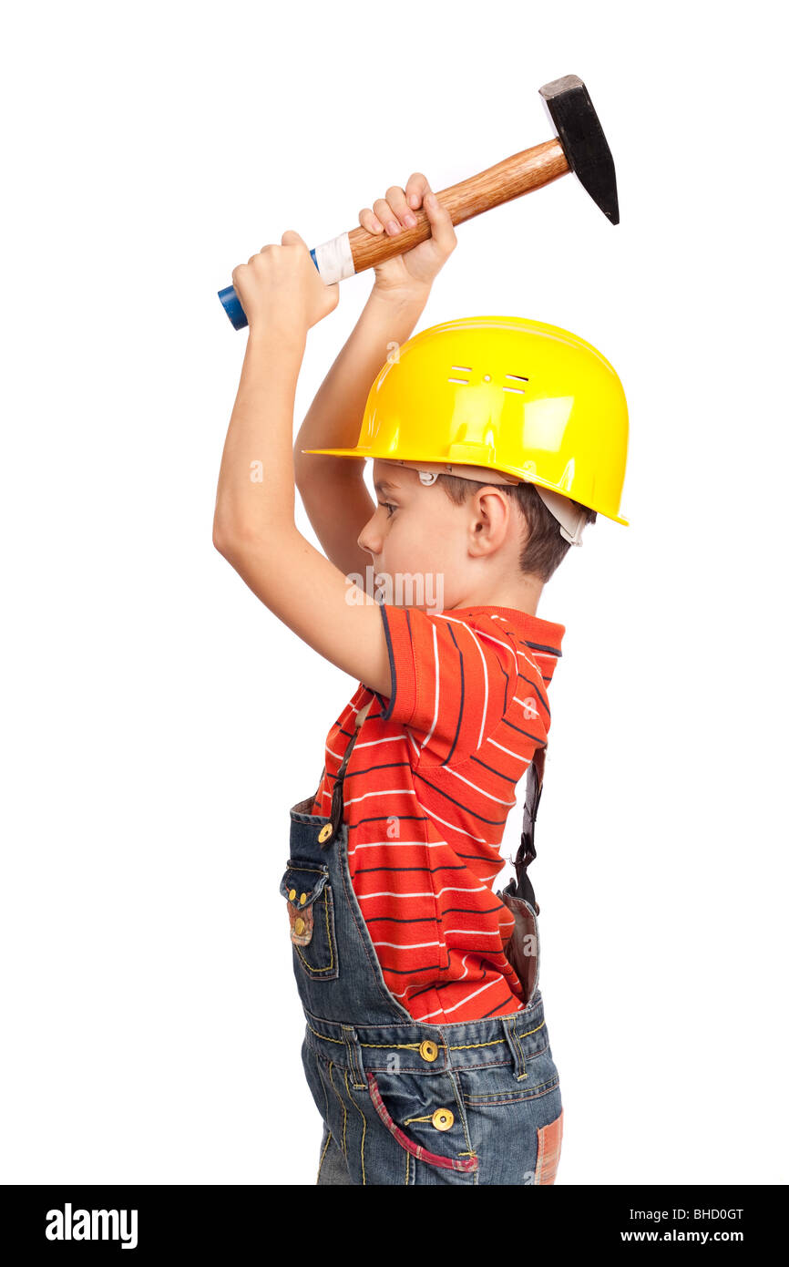 Little kid as a construction worker, hitting with a hammer Stock Photo ...