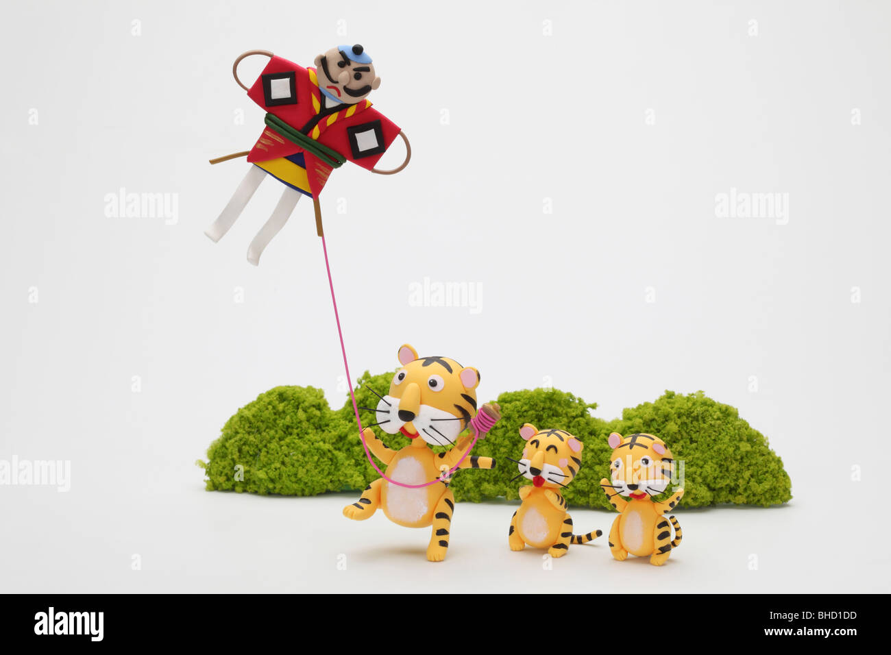 Tiger figurines flying samurai kite Stock Photo - Alamy