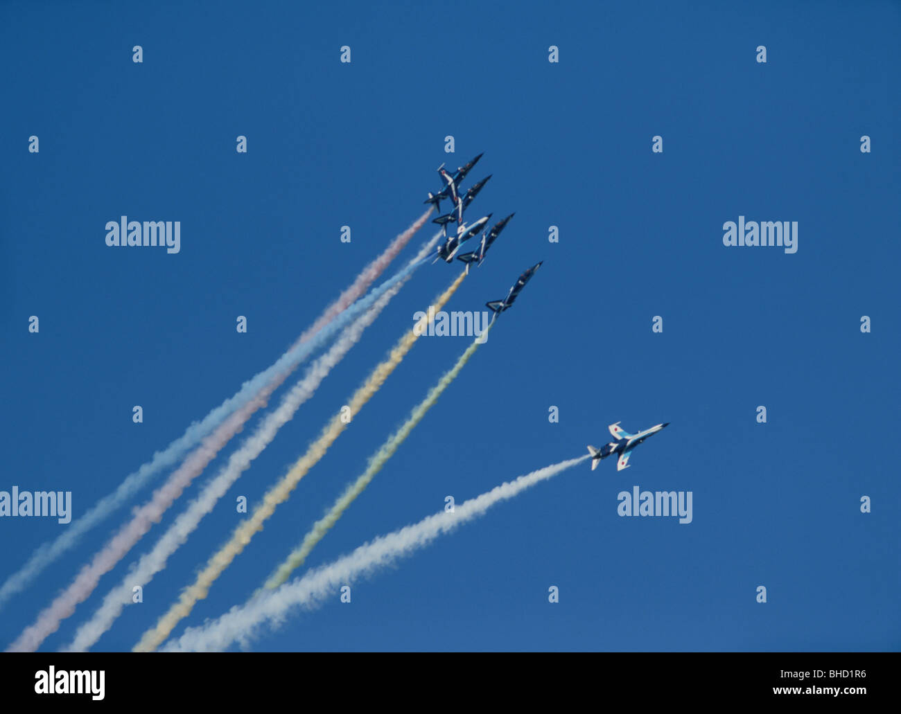 Jets in airshow with colorful smoke Stock Photo - Alamy