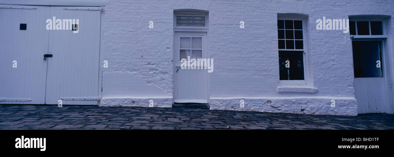 White building on cobblestone street, New Zealand Stock Photo - Alamy