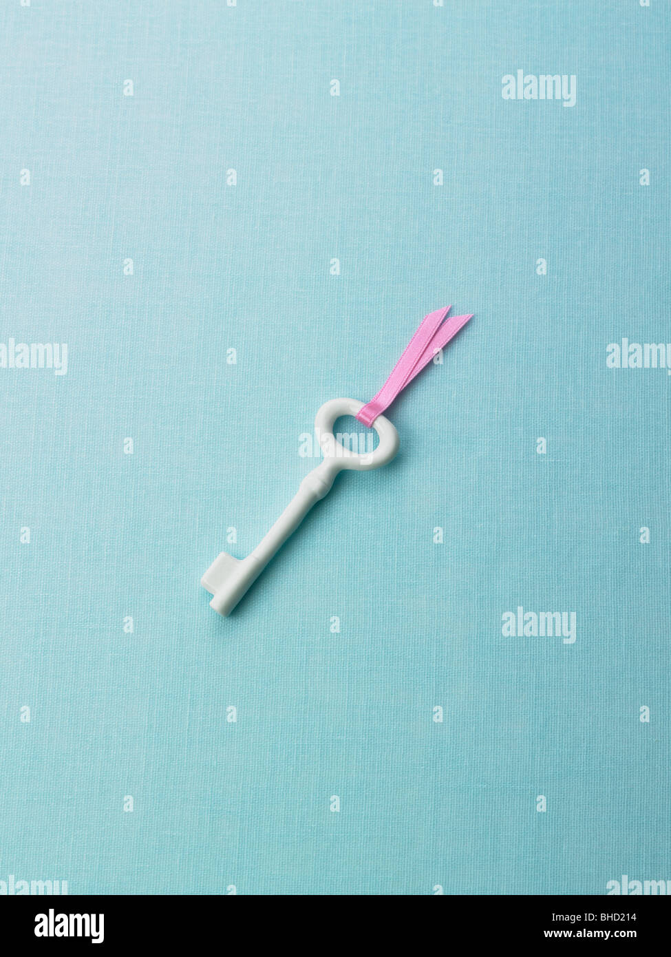 Pottery key with ribbon attached Stock Photo - Alamy