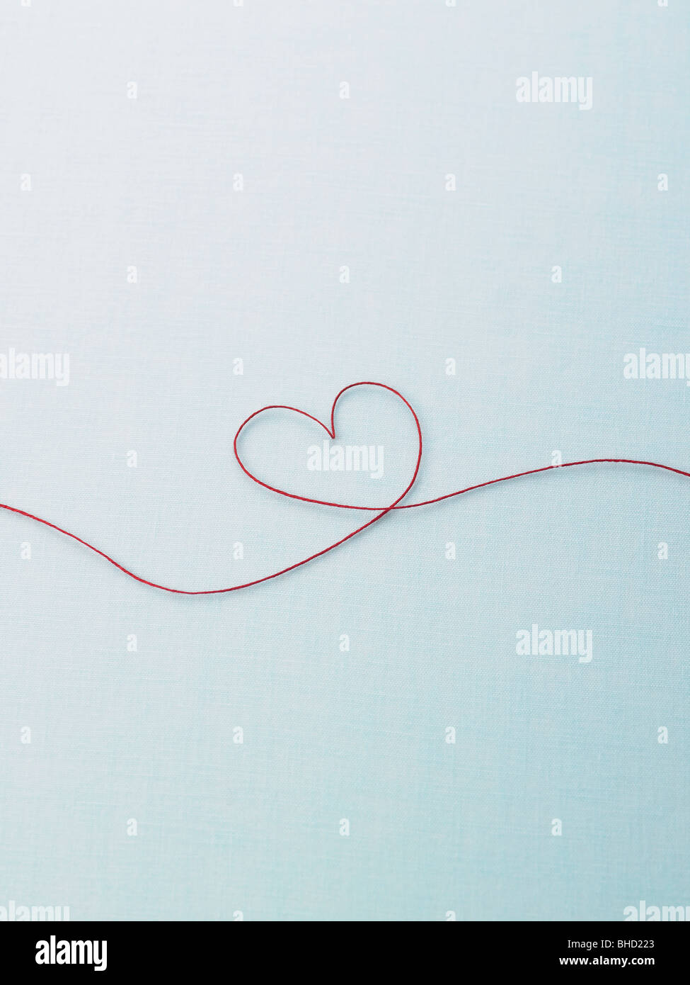 String making heart shape Stock Photo - Alamy