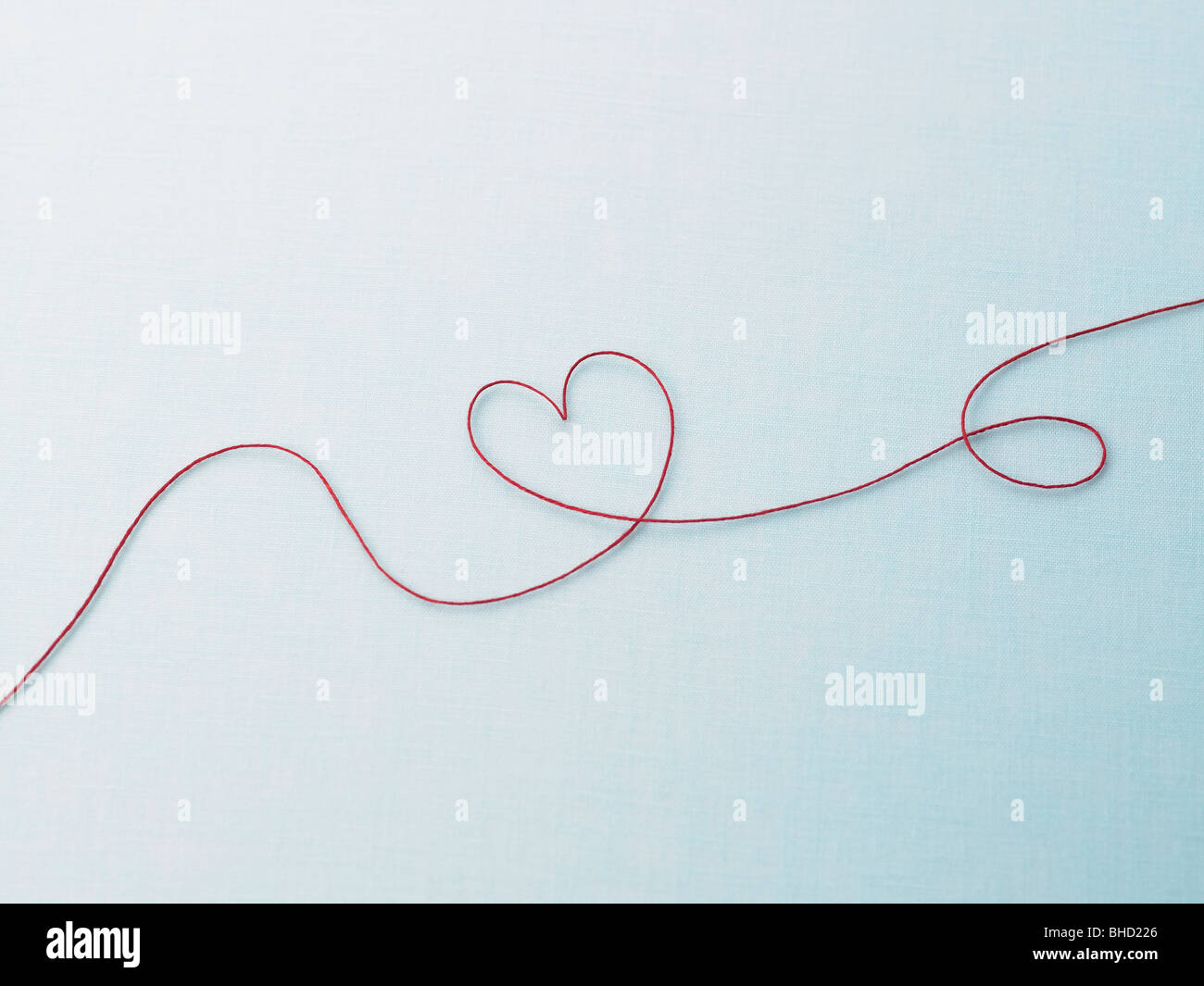 String making heart shape Stock Photo - Alamy