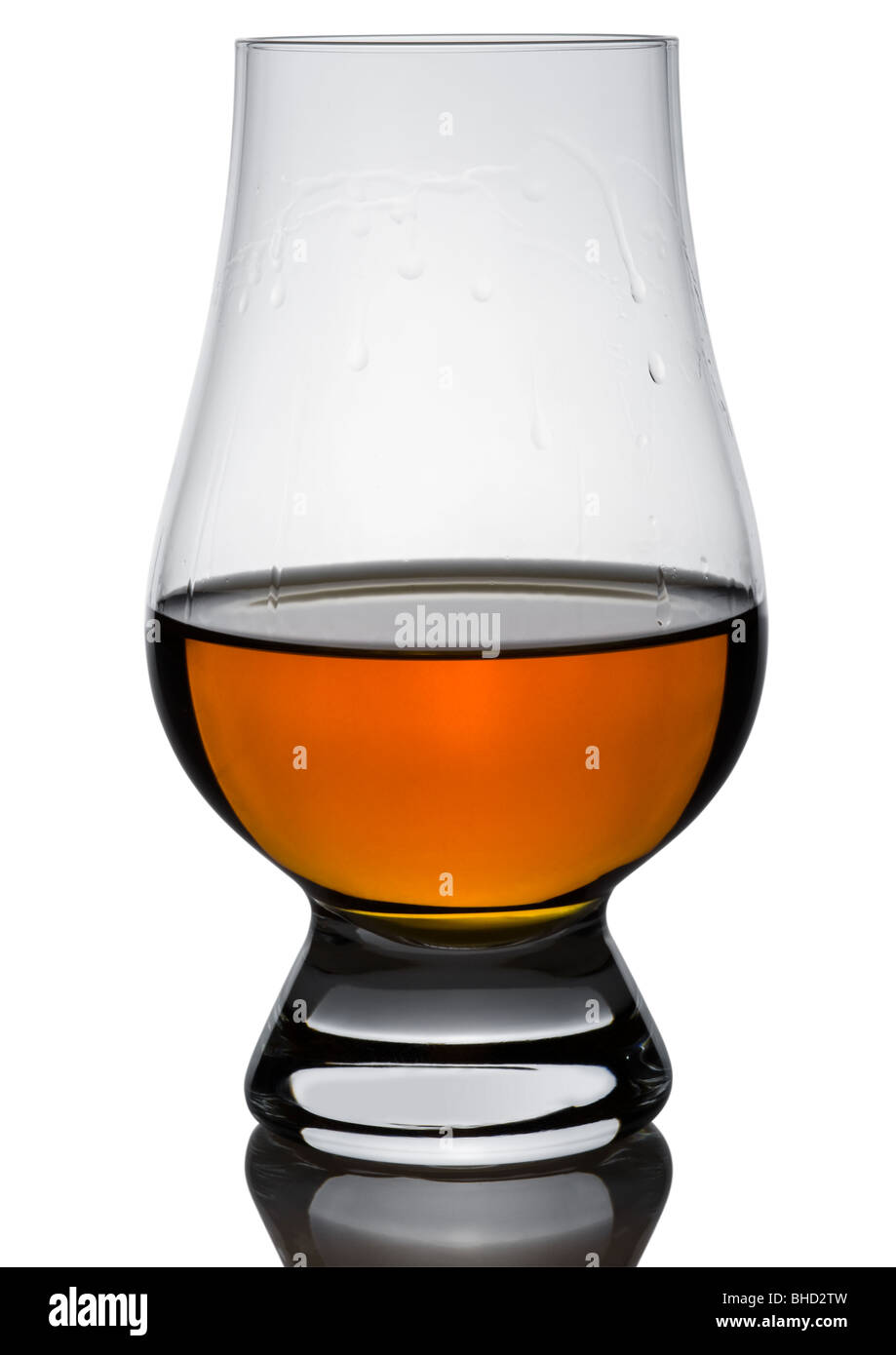 Alcohol in glass, game of light. On a white background Stock Photo - Alamy