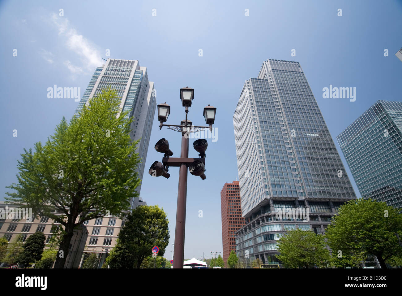 Low angle view of streetlight and skyscrapers. Marunouchi, Tokyo ...