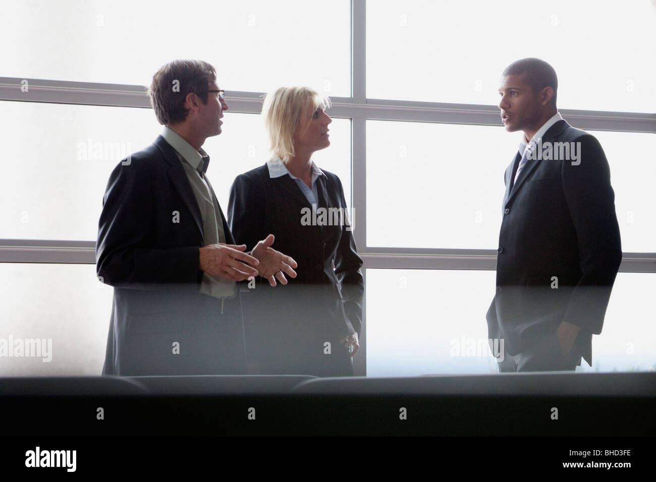 Business people talking in office Stock Photo - Alamy