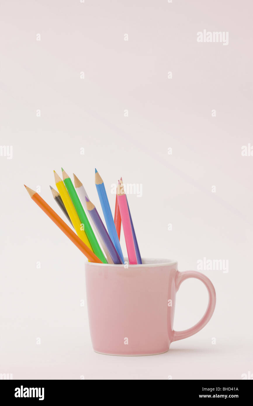 Colored pencils in mug Stock Photo - Alamy