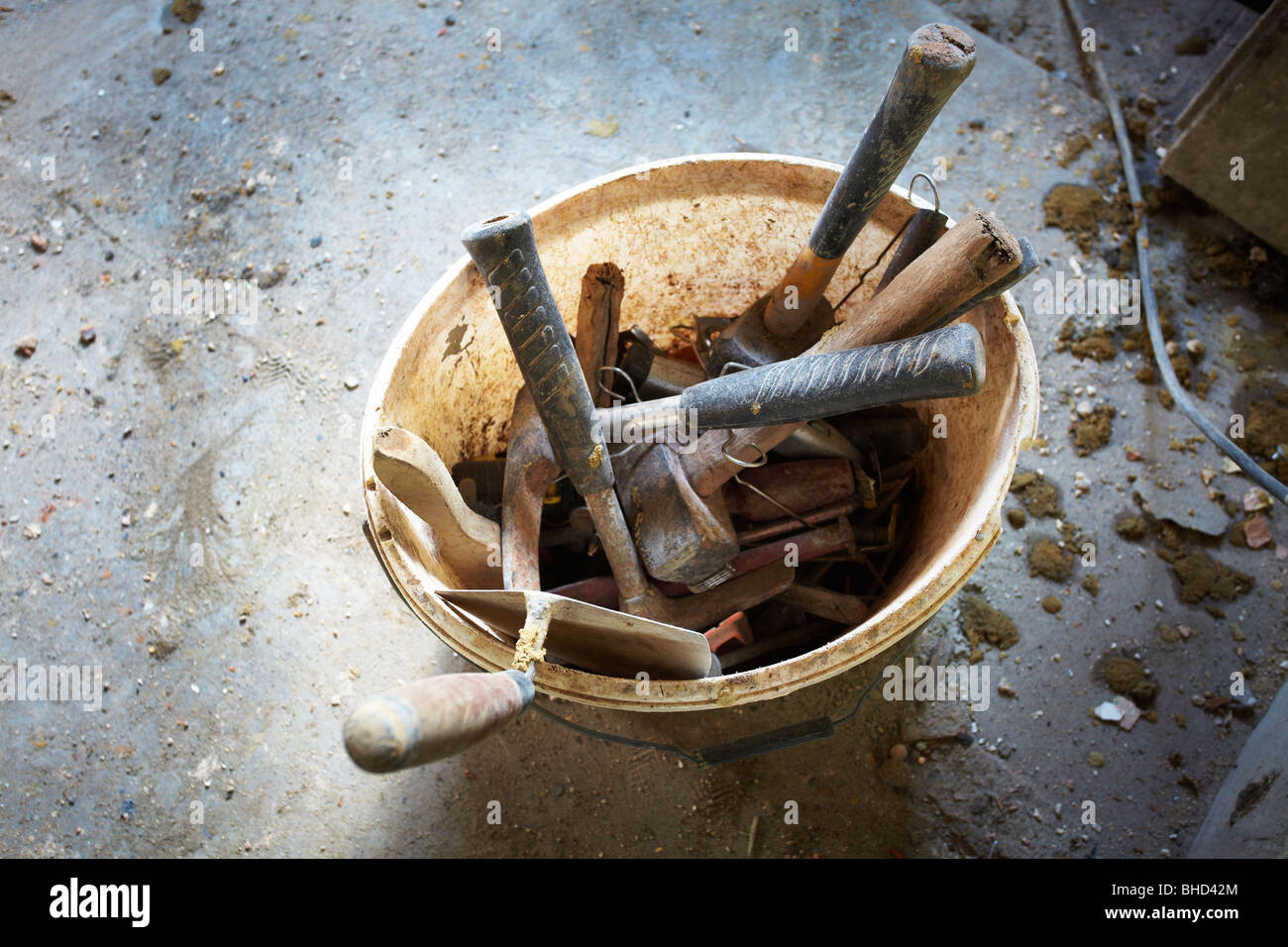 Builders bucket with tools Stock Photo - Alamy