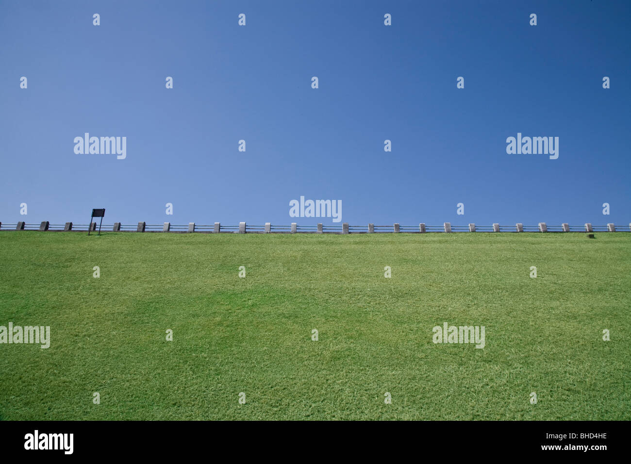 Grassy bank with fence at top, Tama, Tokyo, Japan Stock Photo - Alamy