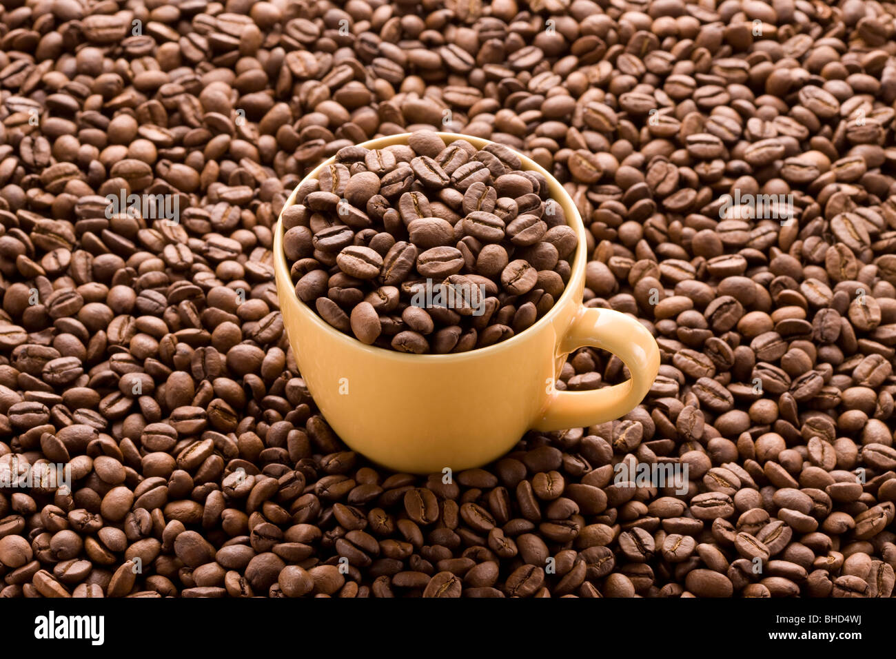 Coffee beans in coffee cup Stock Photo - Alamy