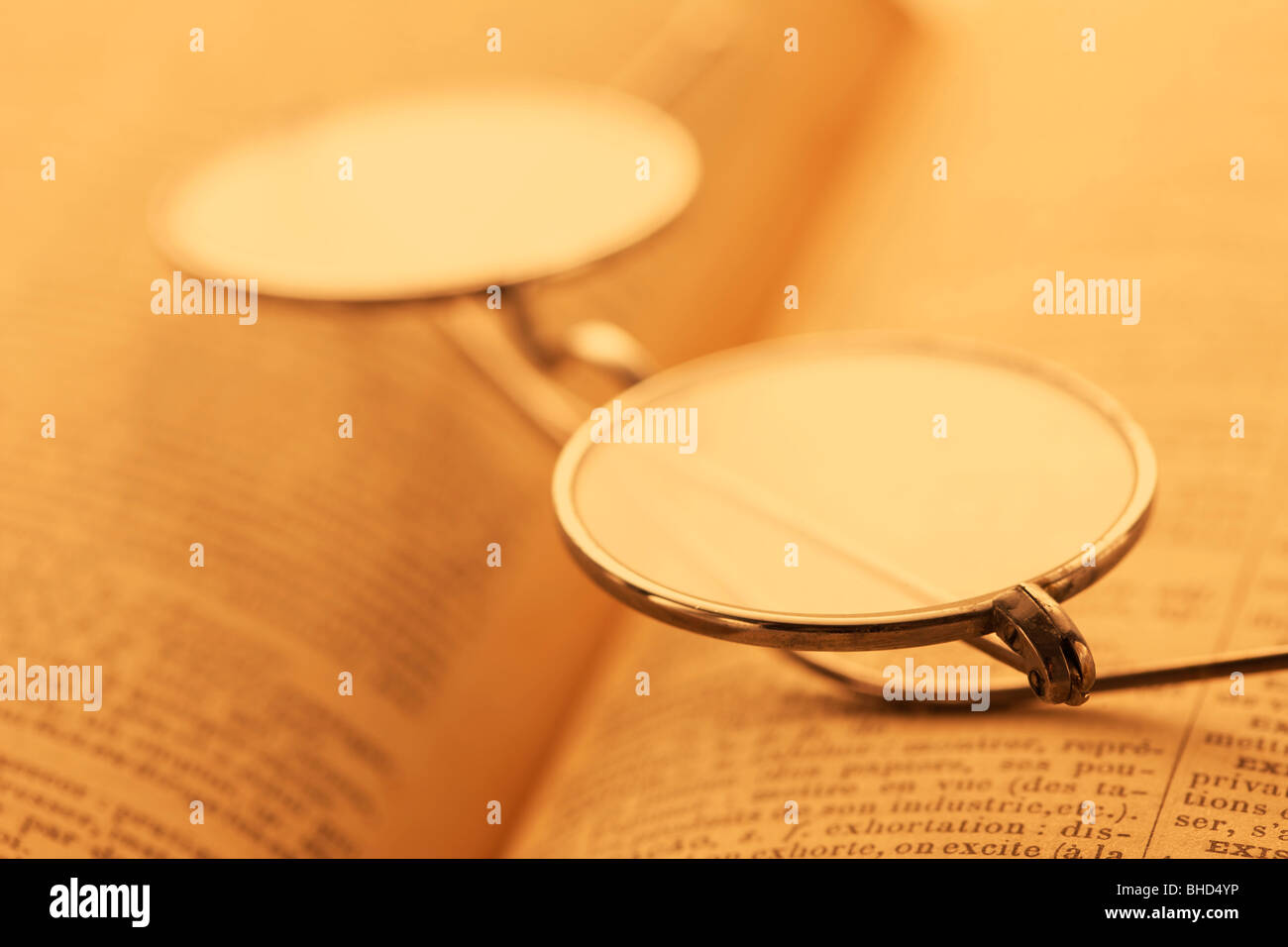 Glasses on book Stock Photo - Alamy