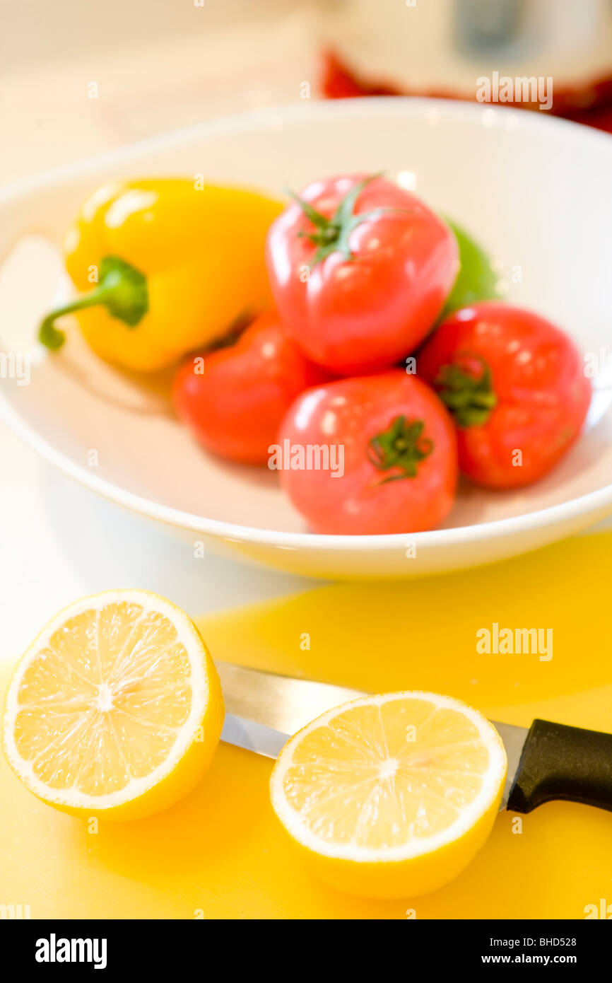 Lemon cut in half and vegetables Stock Photo - Alamy