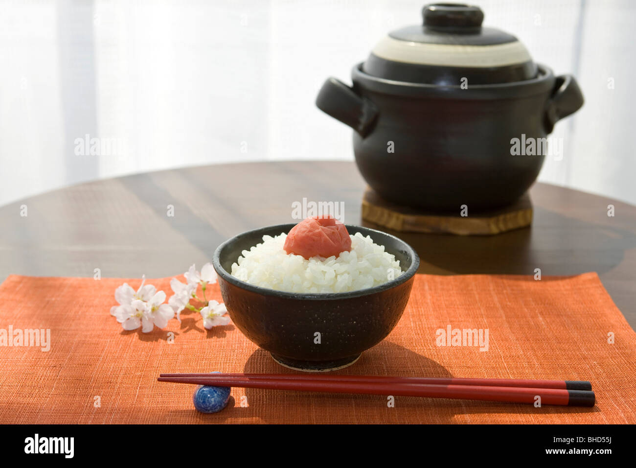 White boiled rice and pickled plum with chopsticks Stock Photo - Alamy
