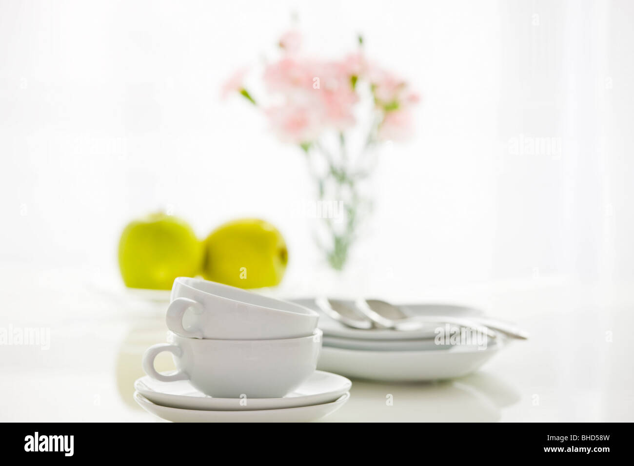 Stack of tea cups placed on table Stock Photo - Alamy