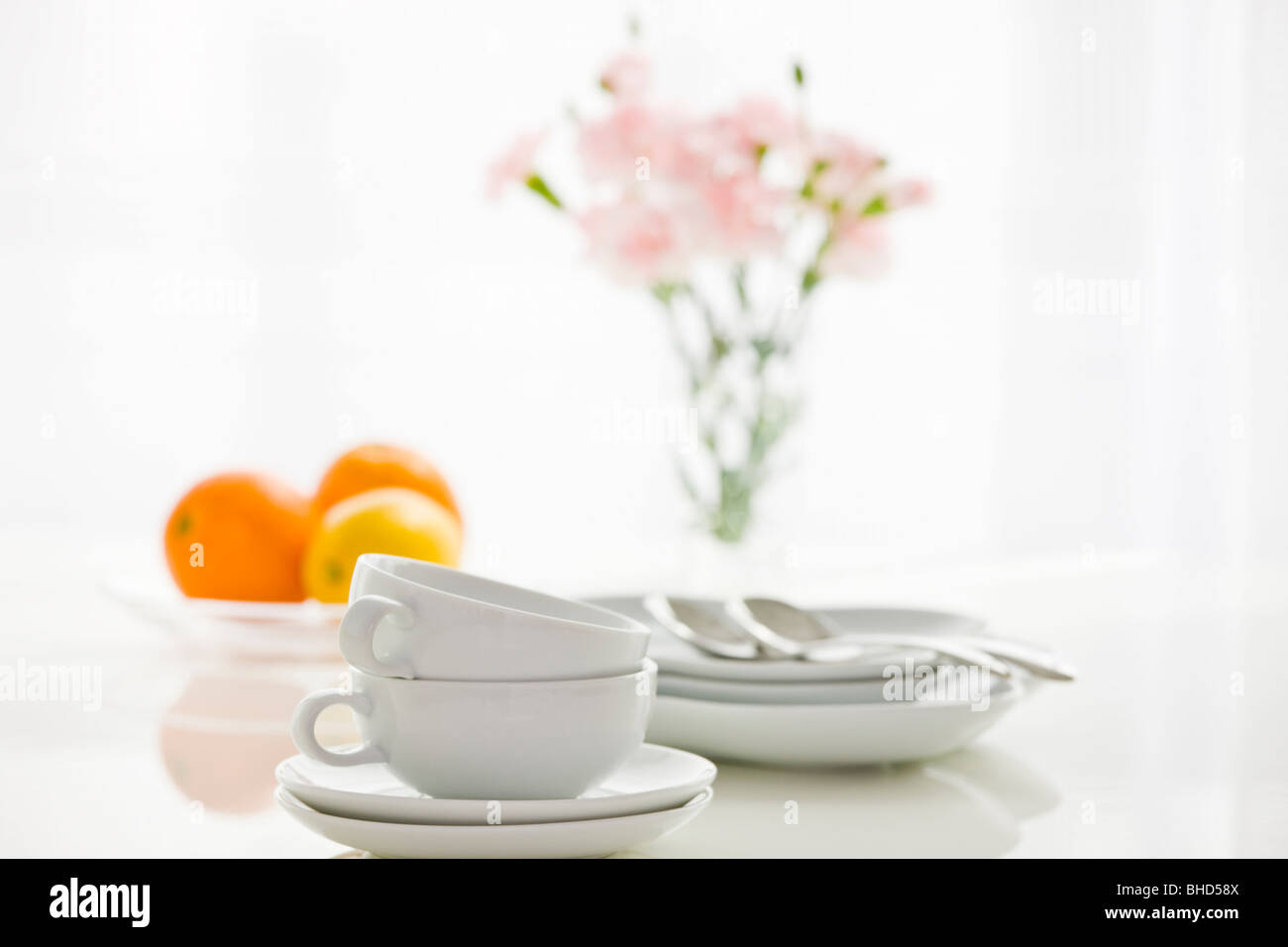 Stack of tea cups placed on table Stock Photo - Alamy