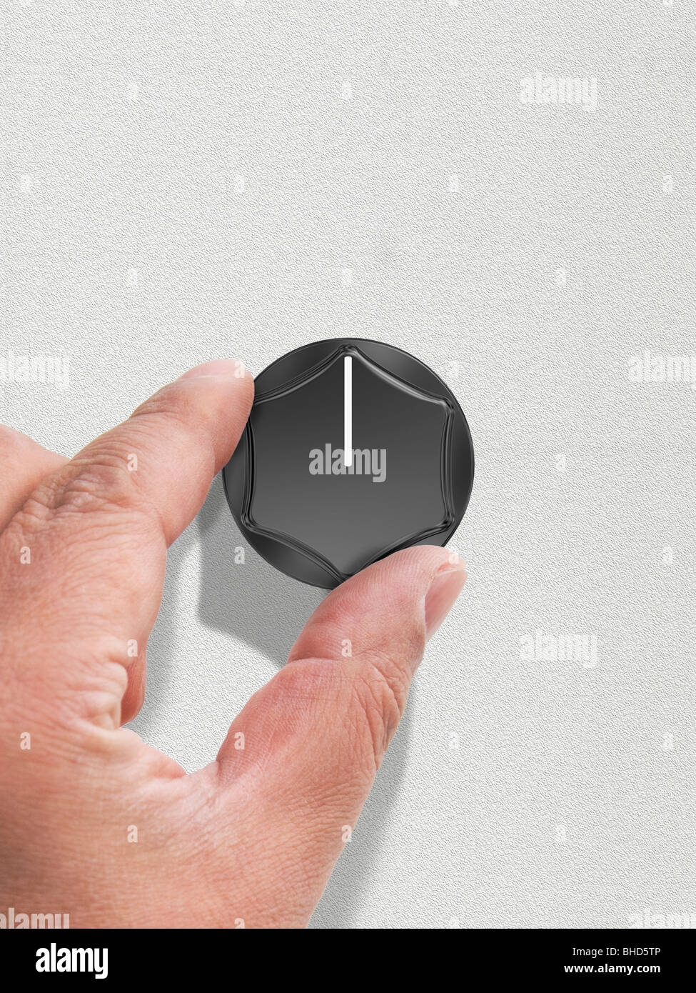 Man turning dial Stock Photo - Alamy