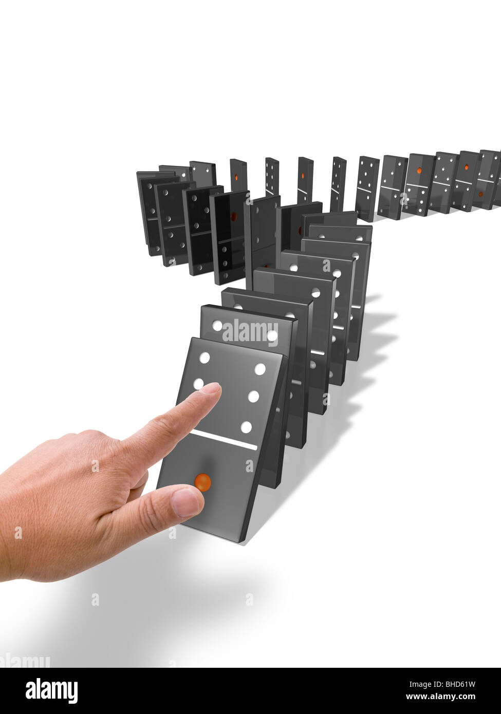 Man pushing a domino Stock Photo - Alamy
