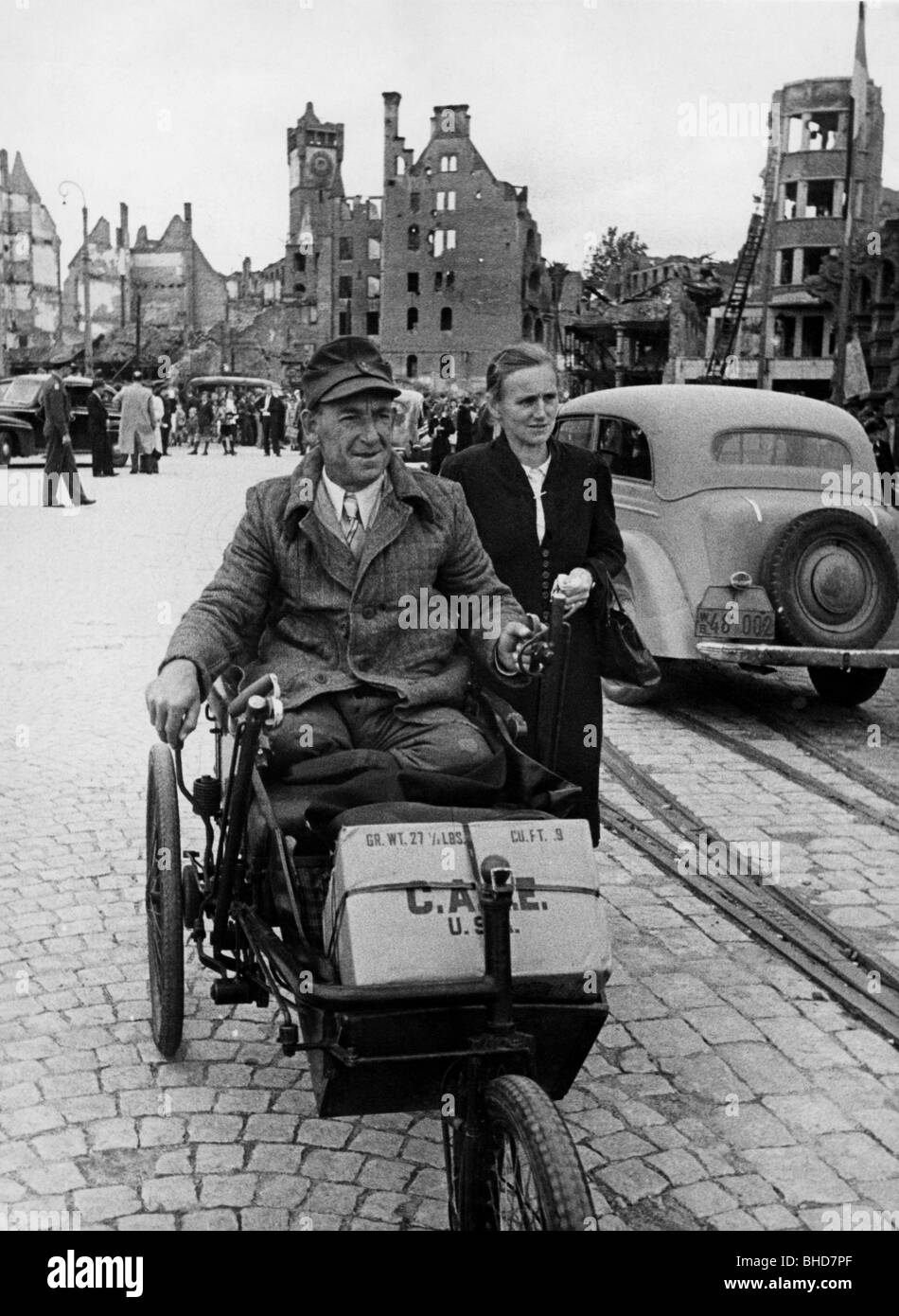 postwar period, CARE Package, disabled man with CARE Package ...