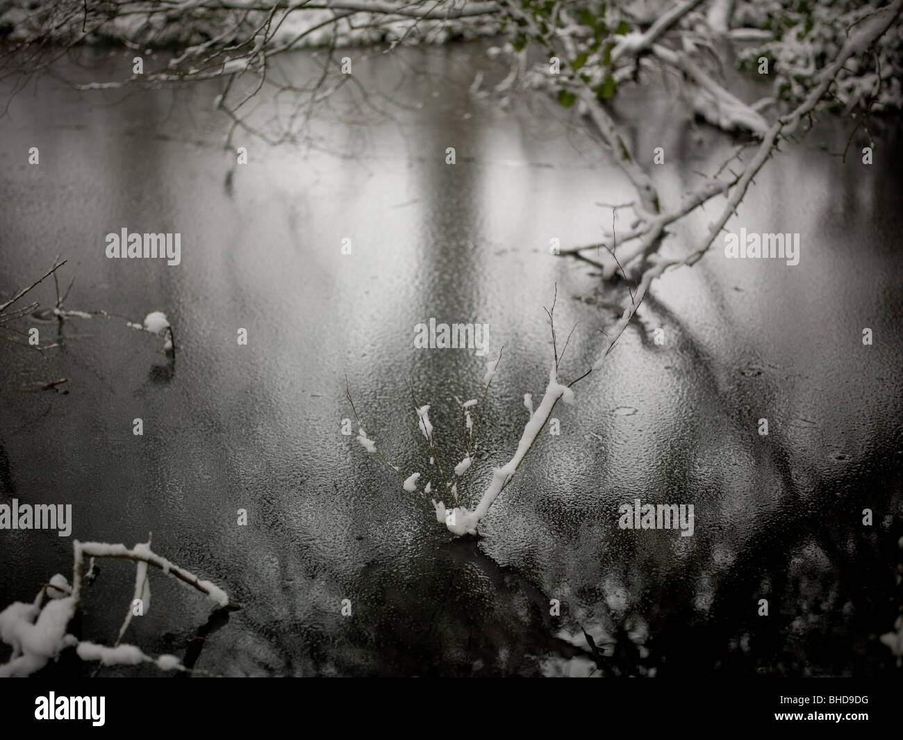 Frozen water with snow on a winters day Stock Photo - Alamy