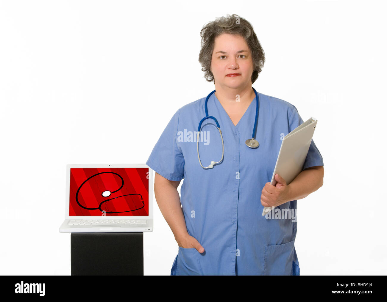 A female nurse portrait holding a patient chart and standing next to a ...