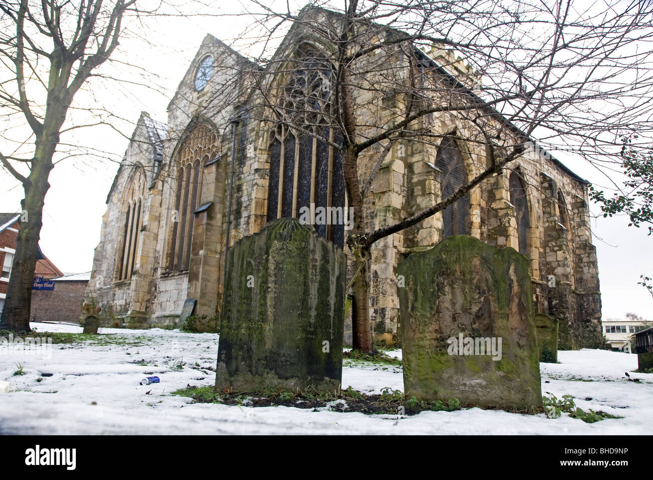 Graves stand in the churchyard of the Parish Church of St Denys of ...