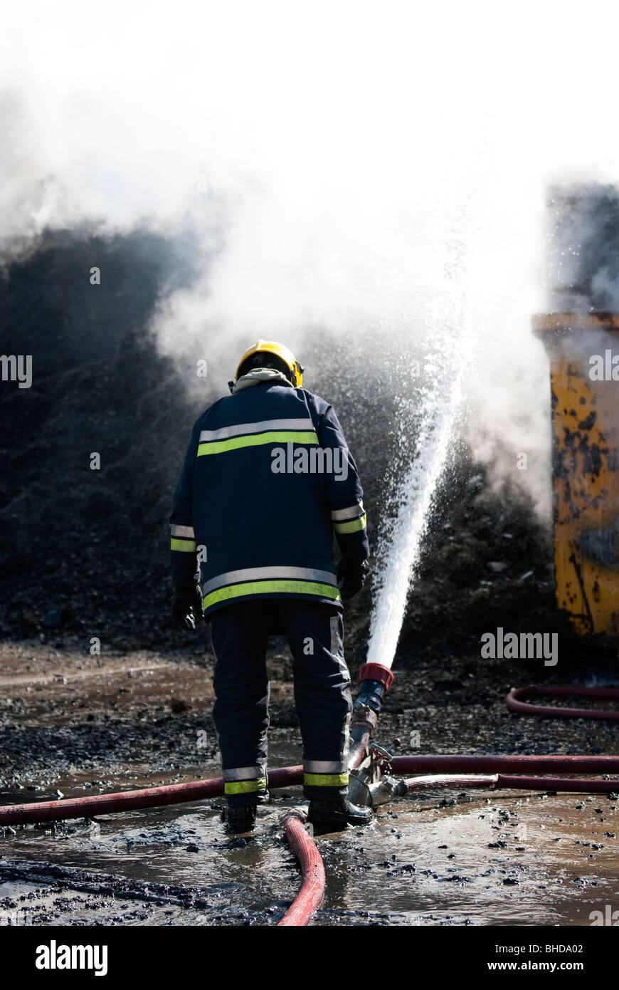 Fireman with ground monitor Stock Photo - Alamy