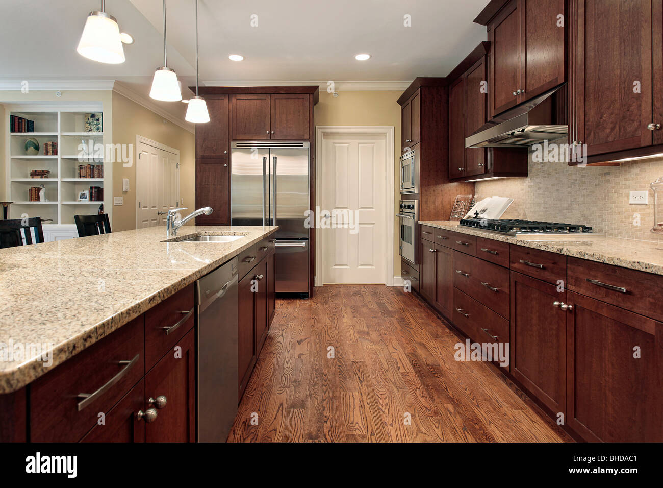 Kitchen in suburban townhome with family room view Stock Photo - Alamy