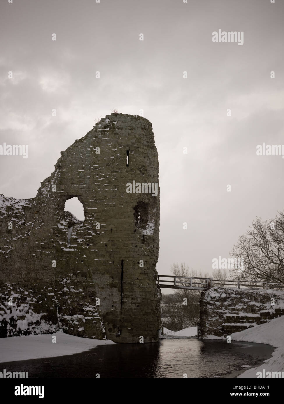 Snow covered castle ruins and moat Stock Photo - Alamy