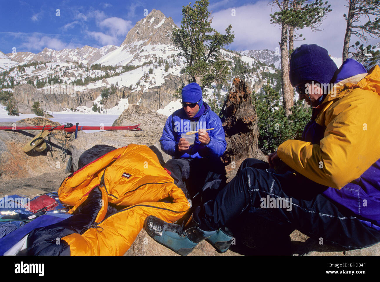 Men eating while snow camping Stock Photo - Alamy
