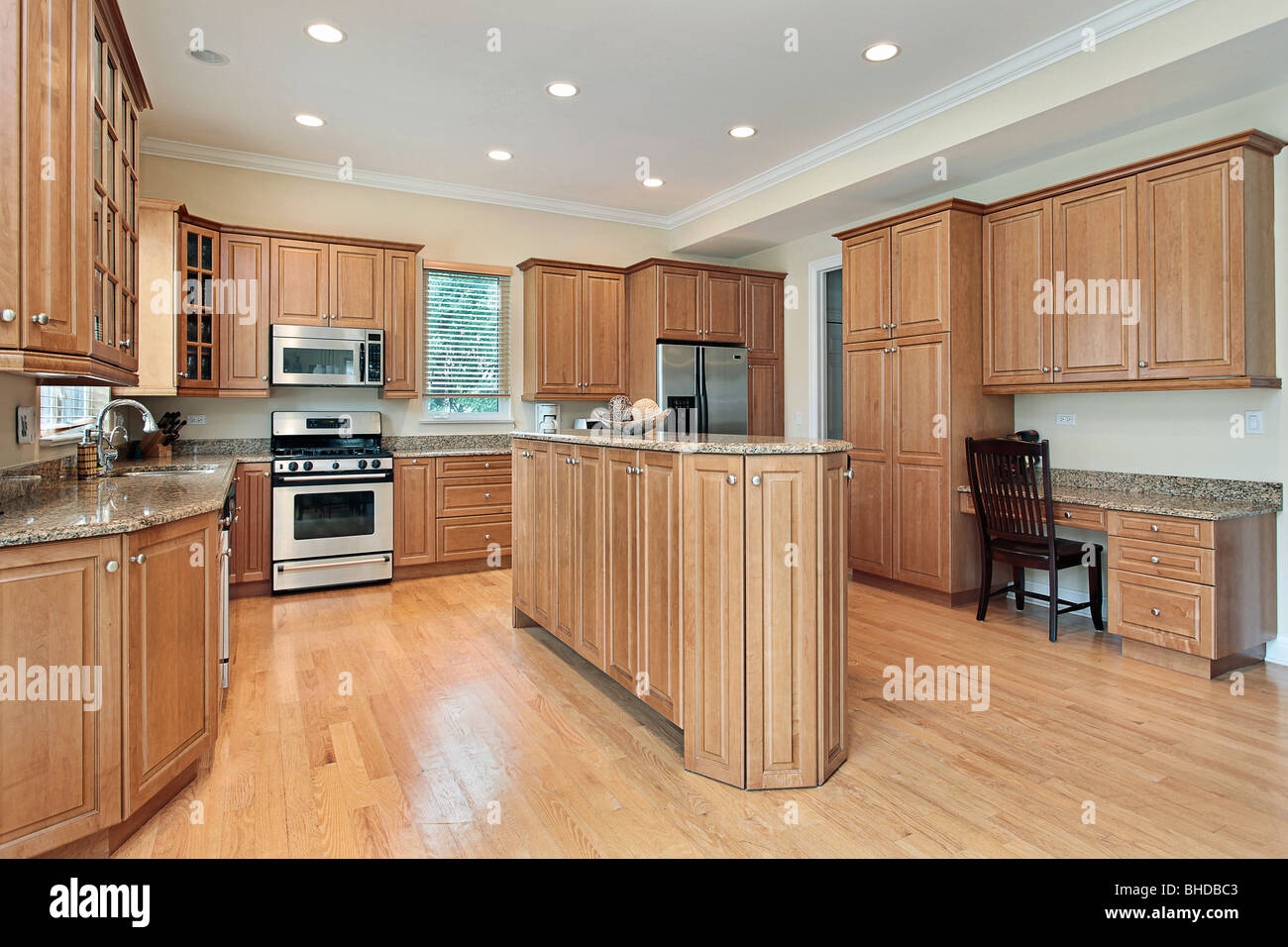 Kitchen in suburban home with oak wood cabinetry Stock Photo - Alamy
